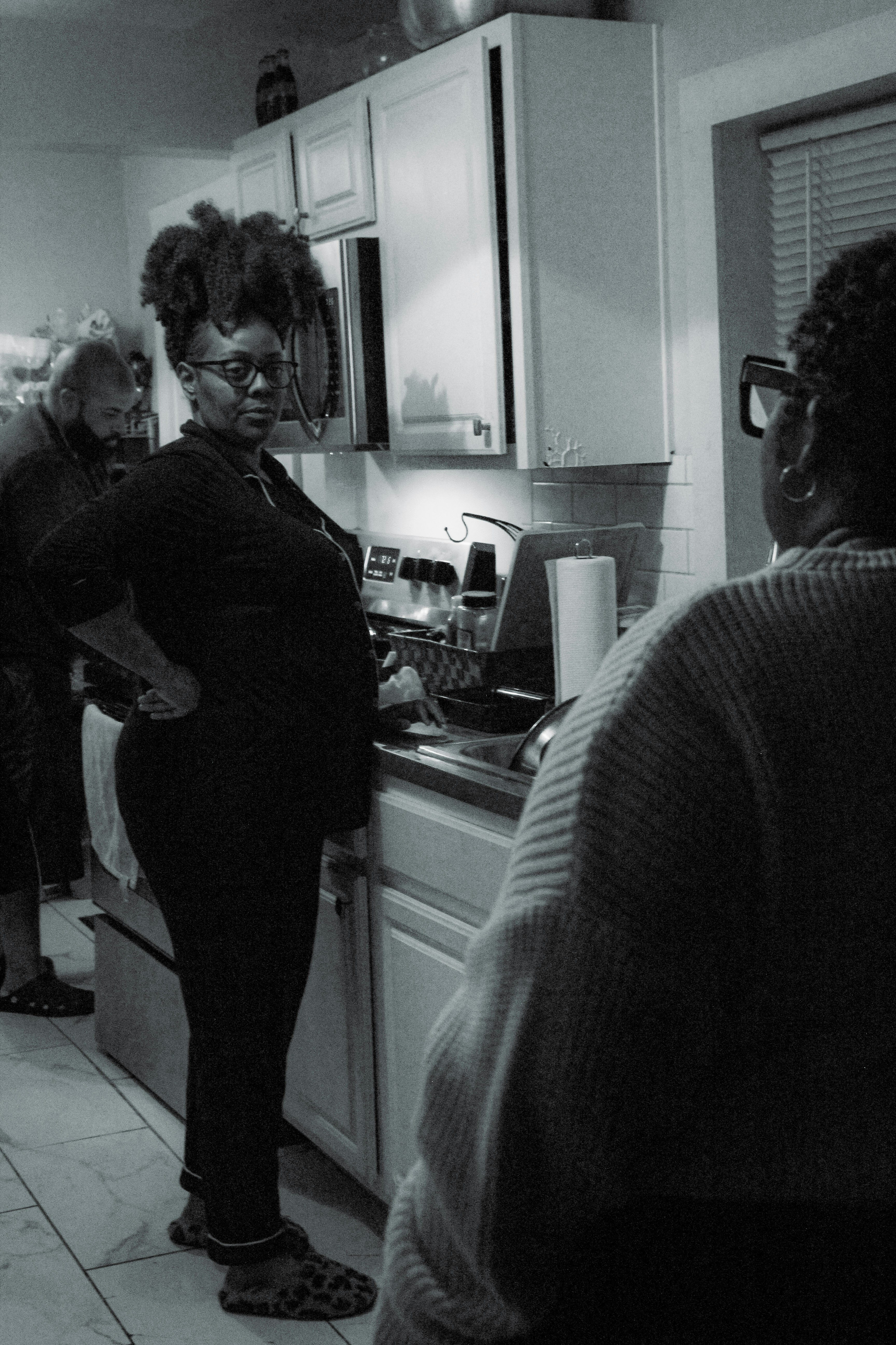 Stove-side Dialogue: A Candid Moment in a Home Kitchen