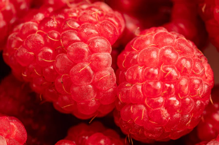 Ruby Mosaic: A Macro Portrait of Raspberry Clusters