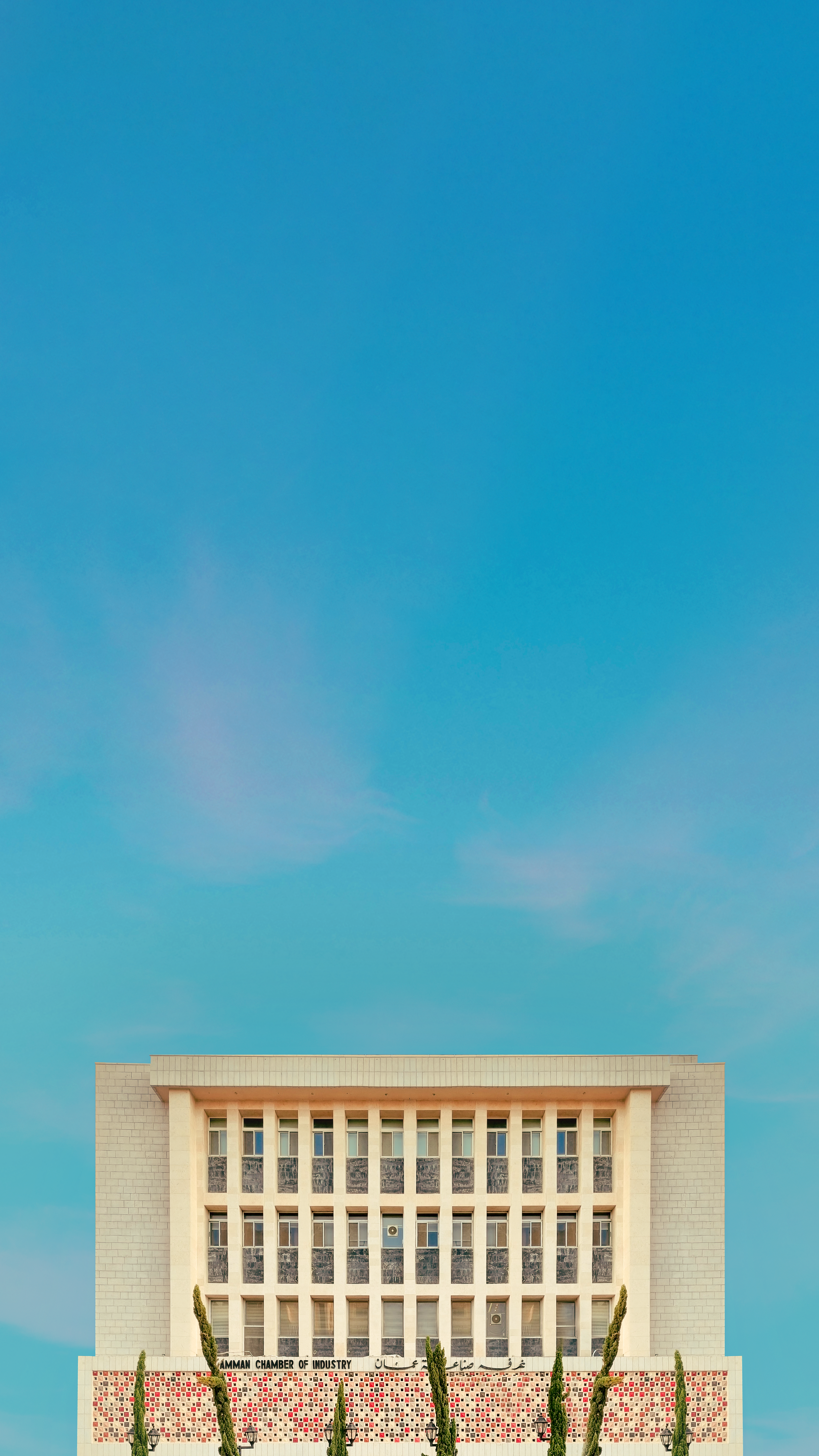 A large building with a cactus in front of it photo – Free Building ...