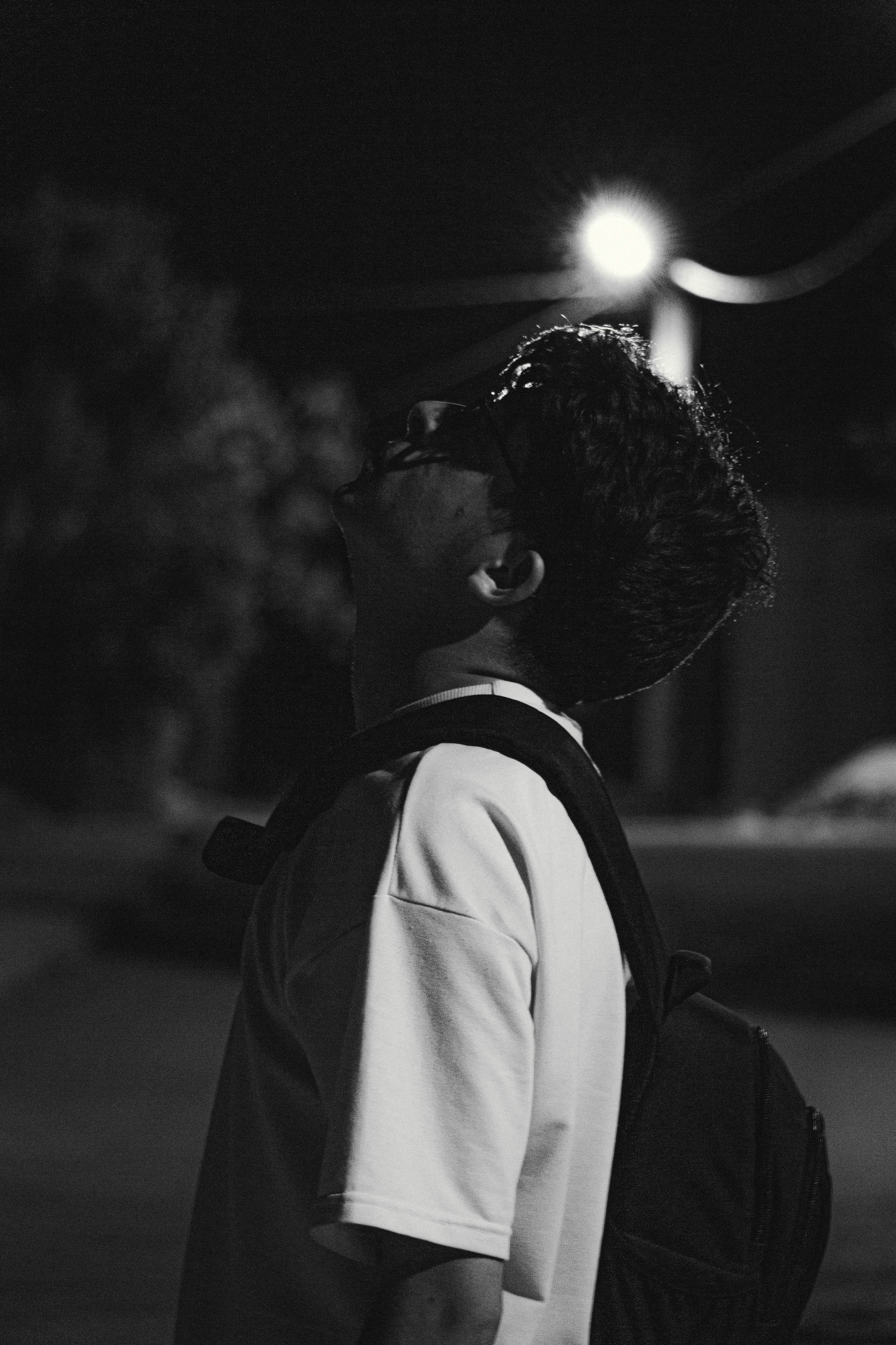 Nighttime Reverie: A Youthful Gaze Toward Light