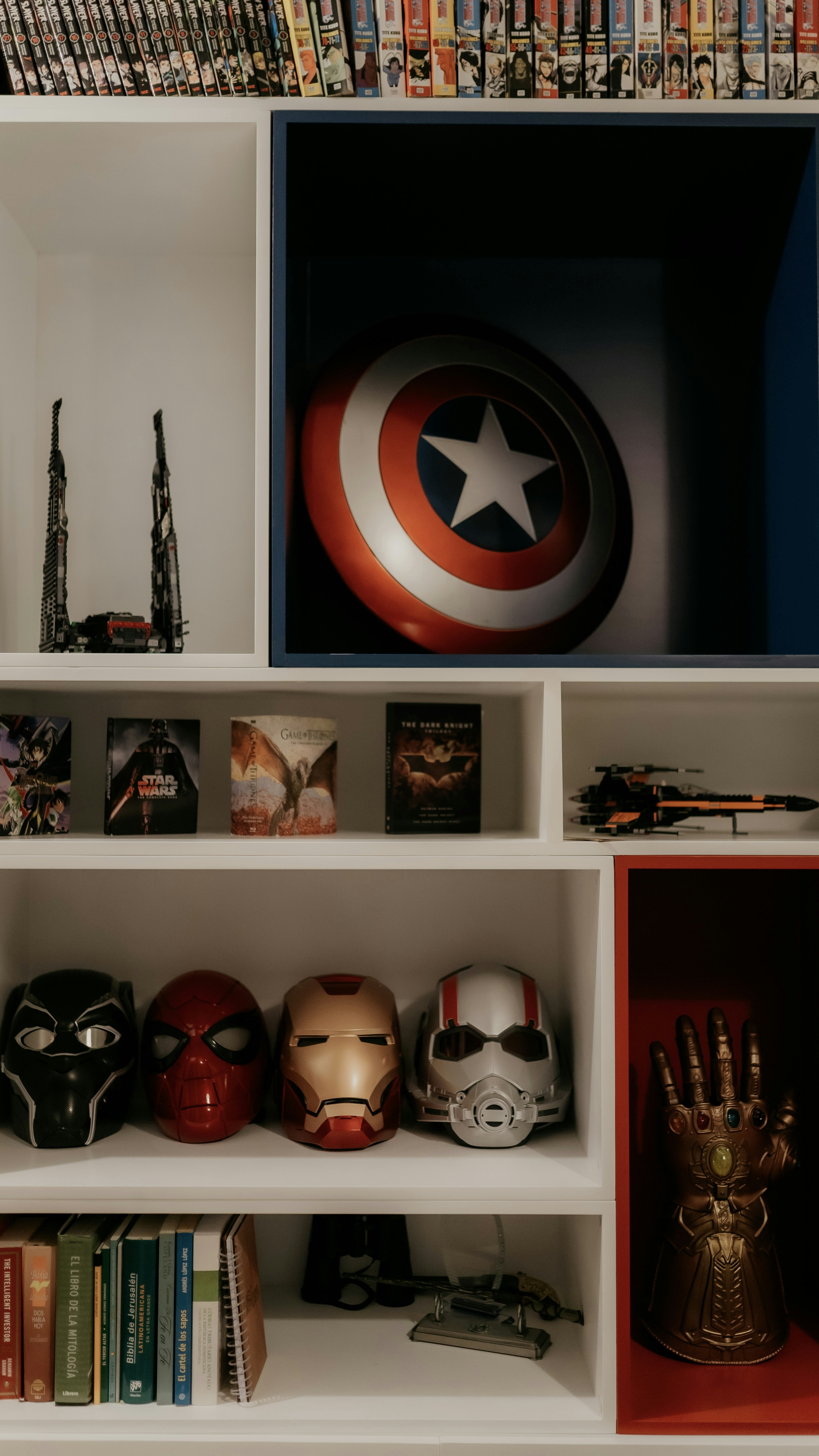 A shelf with a captain america helmet on top of it photo – Free Estados ...