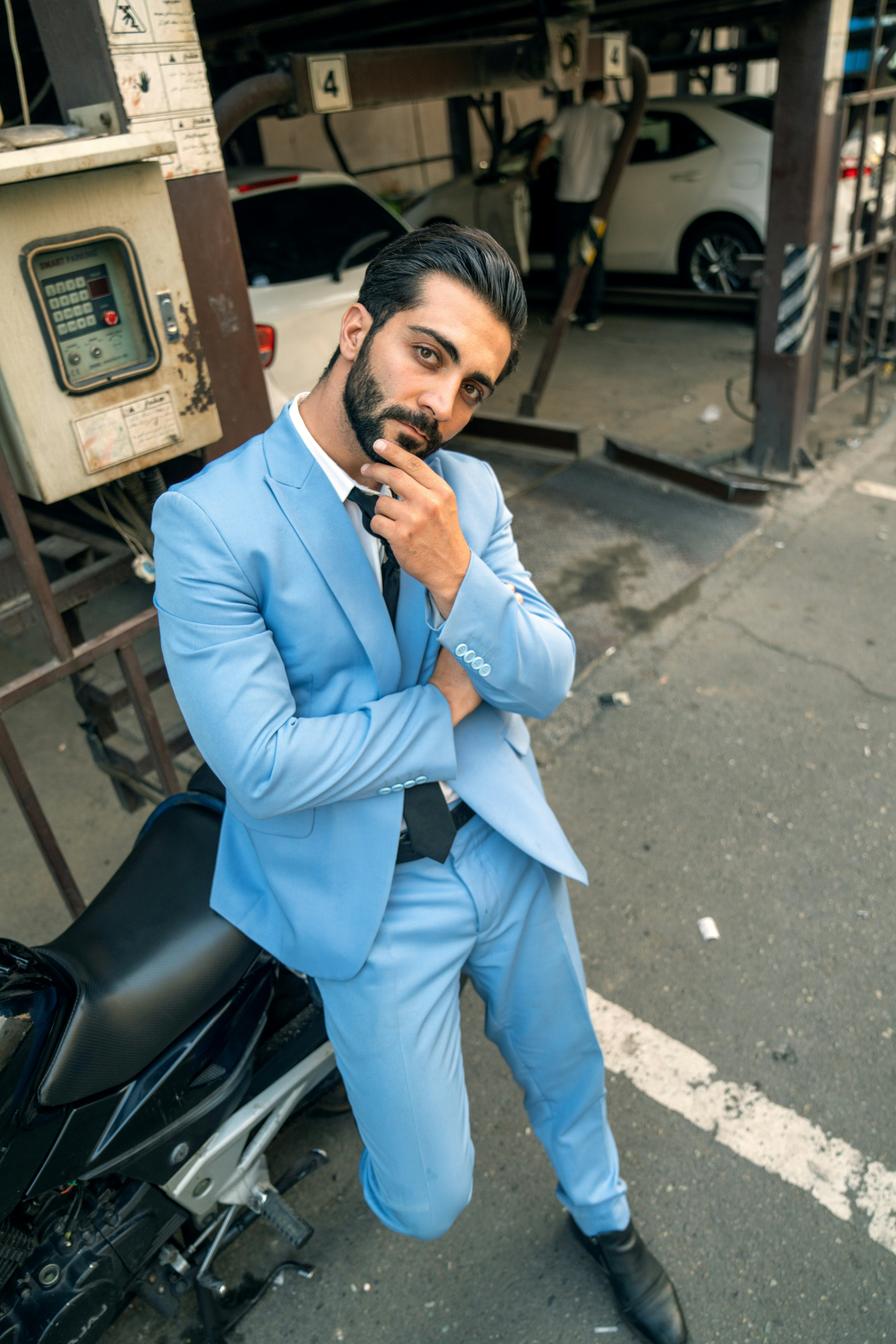 A man in a blue suit sitting on a motorcycle photo – Free Formal wear ...