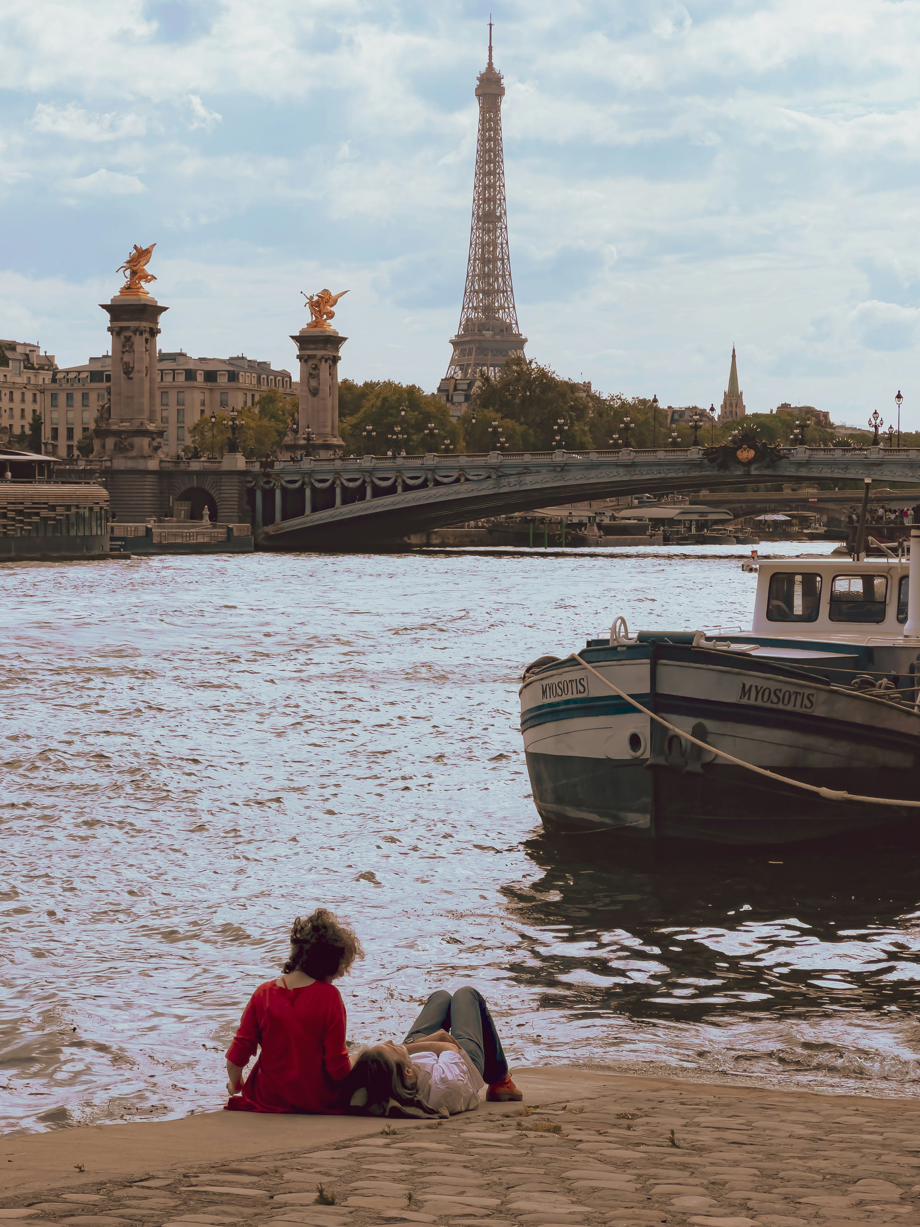 Riverside Quietude: A Paris Moment Under the Eiffel Tower