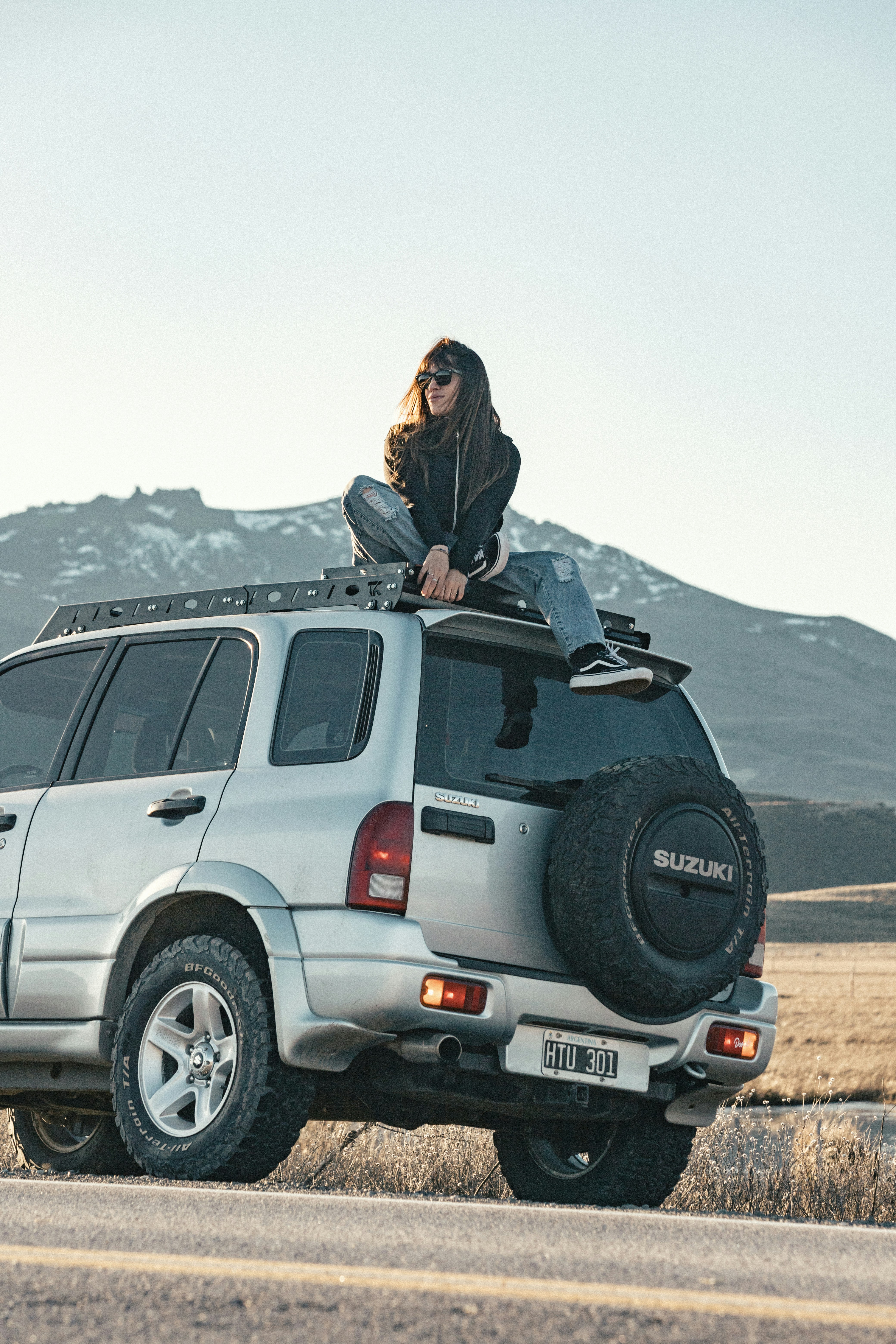 Rider on the Roof: Quiet Confidence Above the Highway
