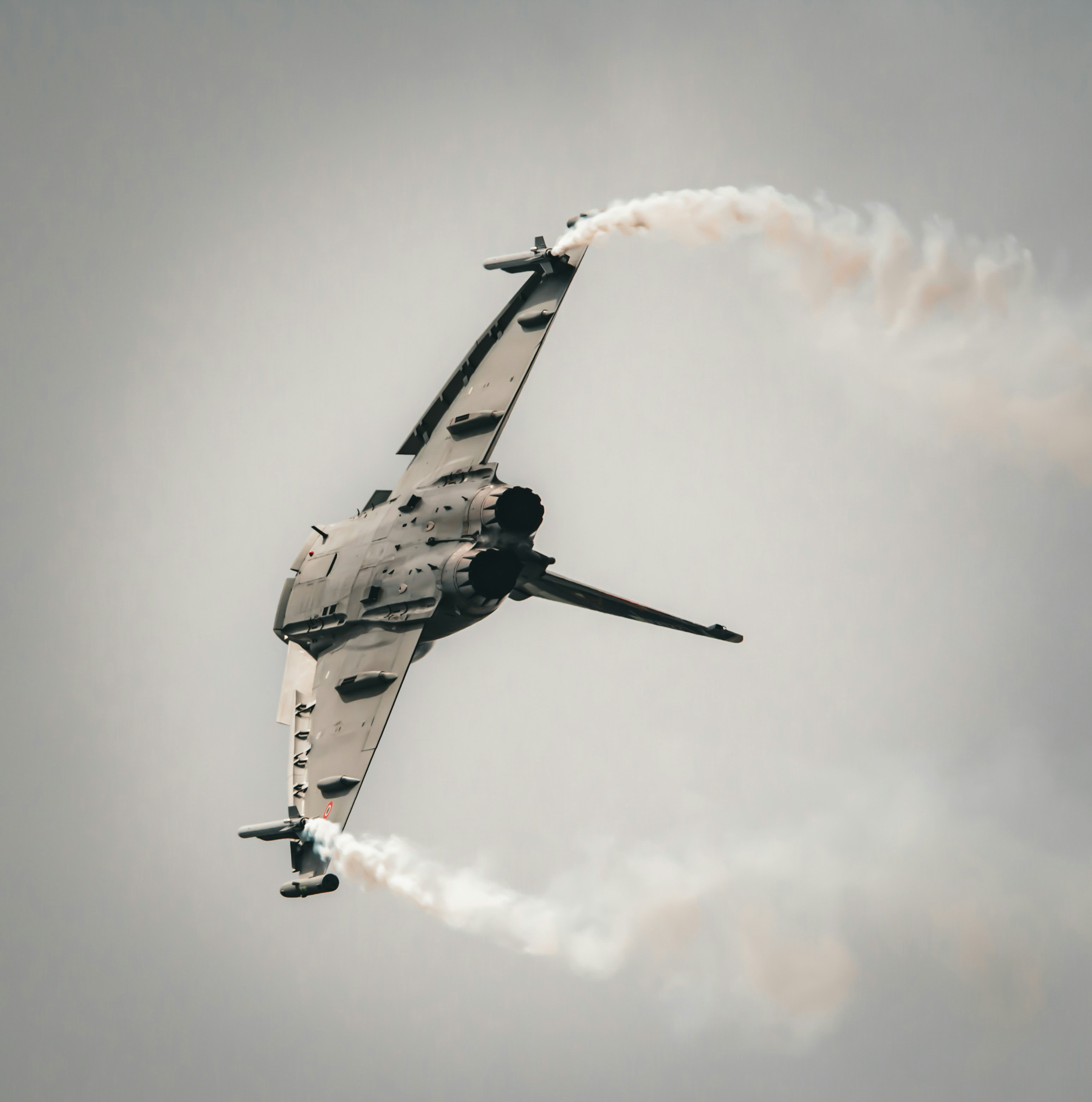 Soaring Phantom: A Jet’s Ascent in a Narrow White Trail