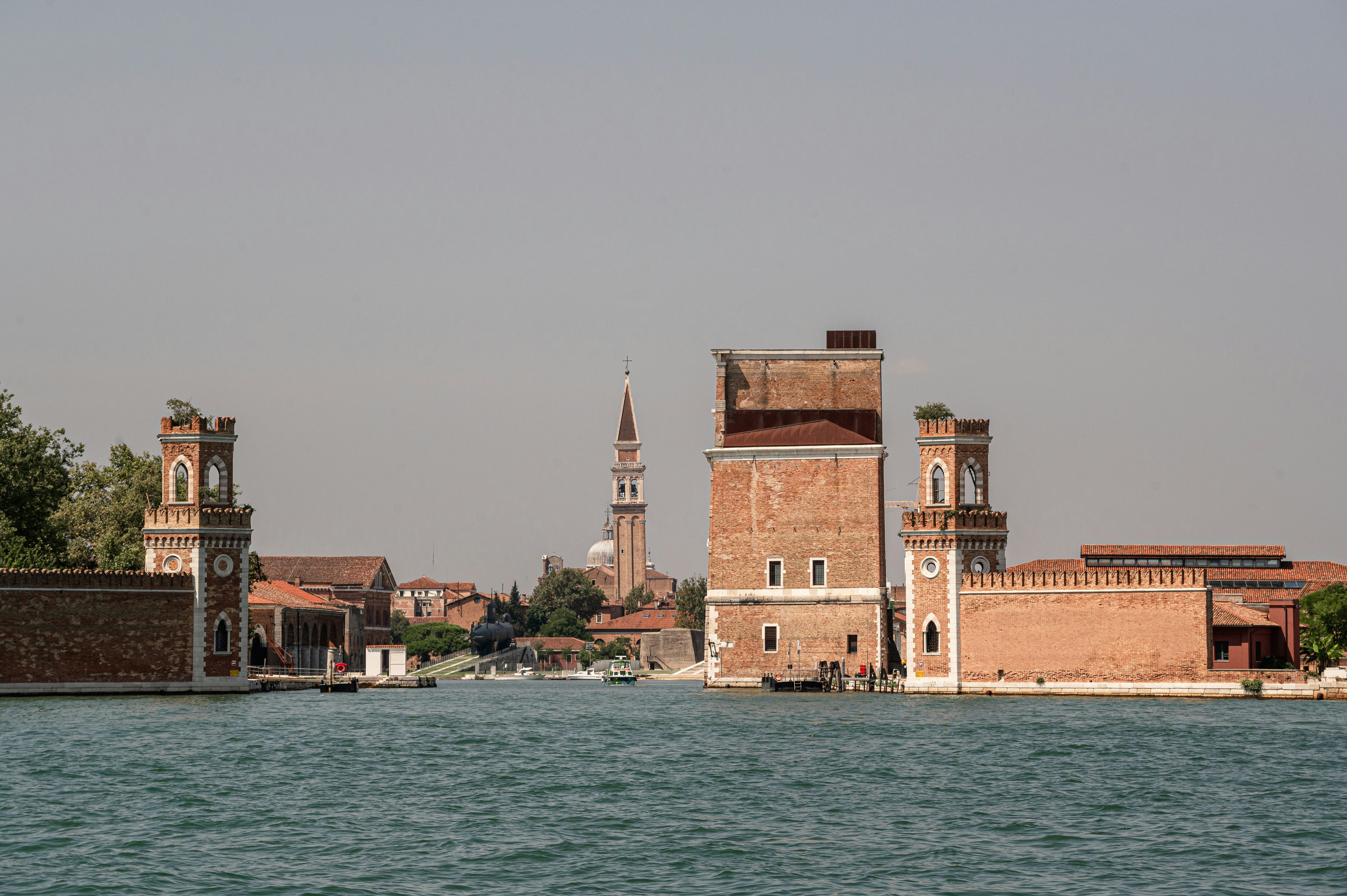 Spired Brick Fortifications Framing a Tranquil Canal Harbor