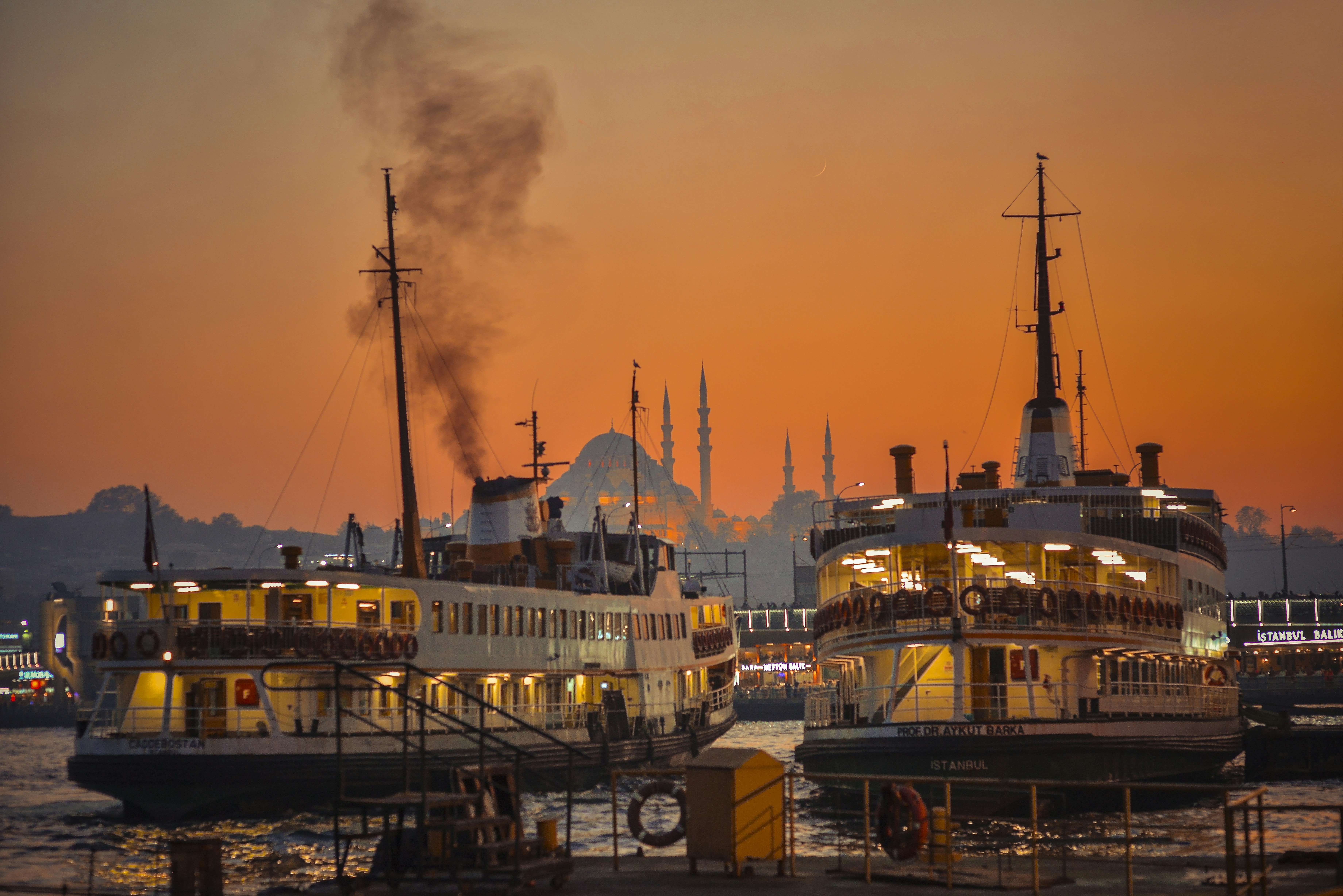 Dusk on the Bosphorus: Twin Ferries Framed by a Mosque Silhouette