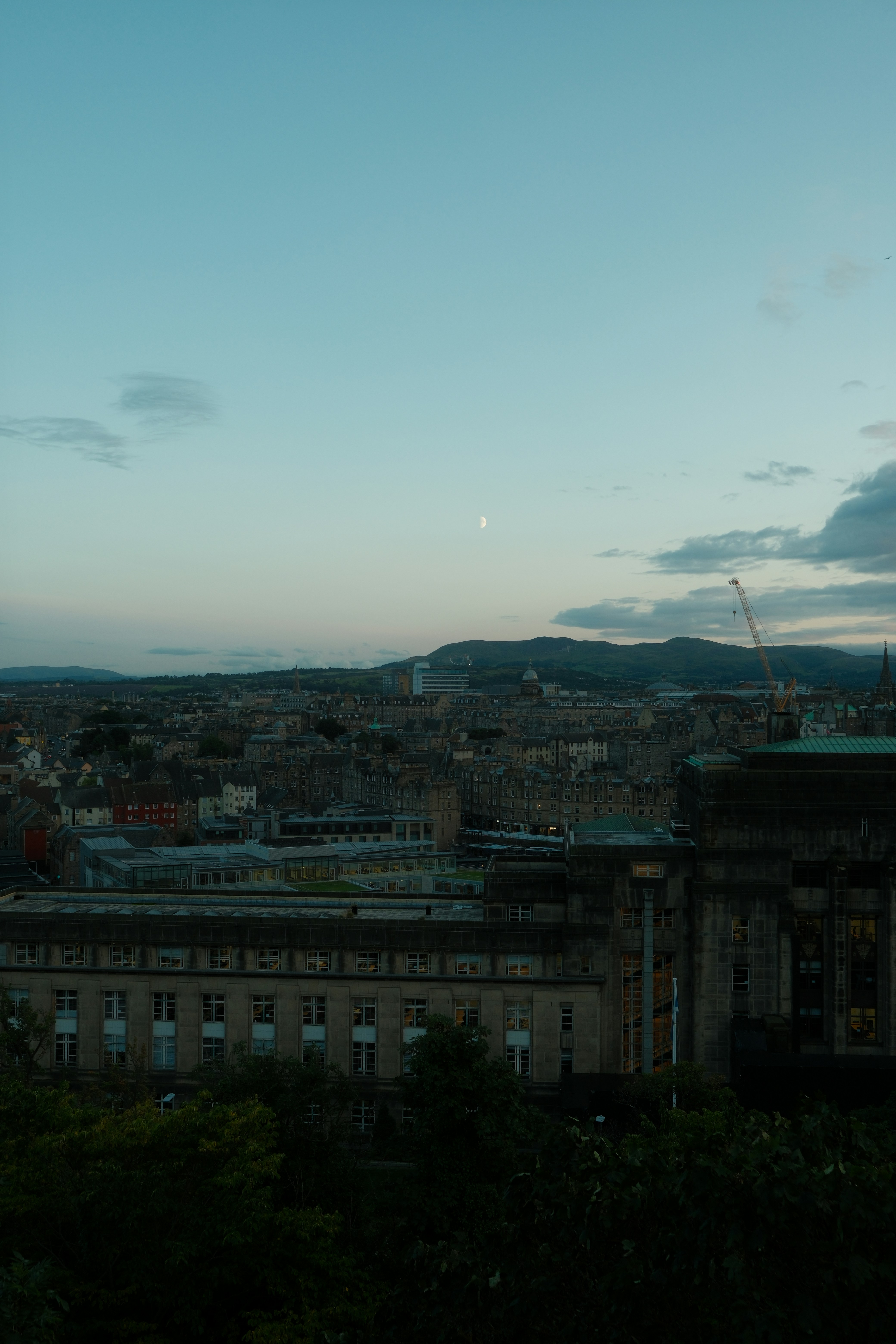 Moonrise Over the City: Dusk Convergence