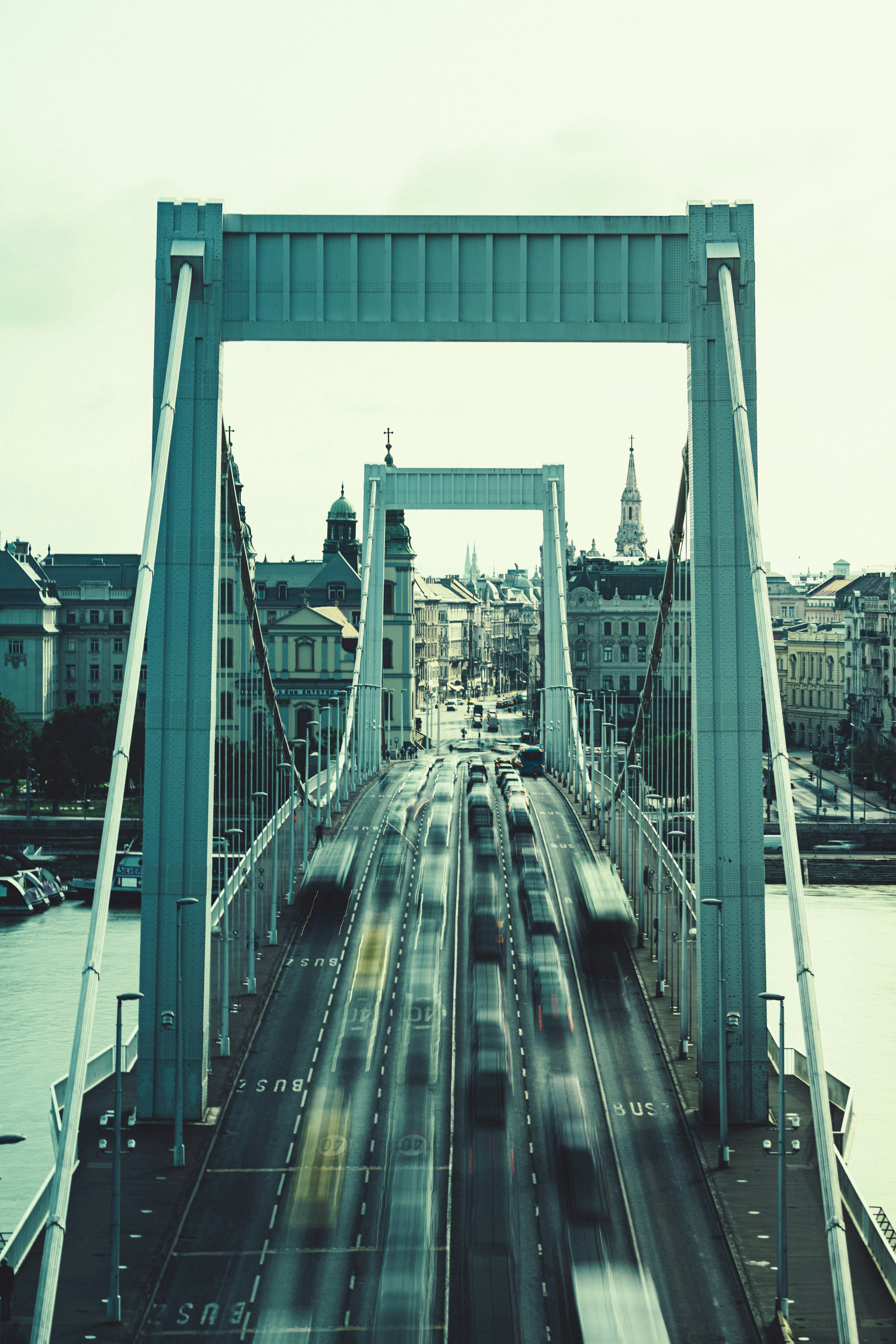 A view of a bridge with cars going over it photo – Free Car Image on ...