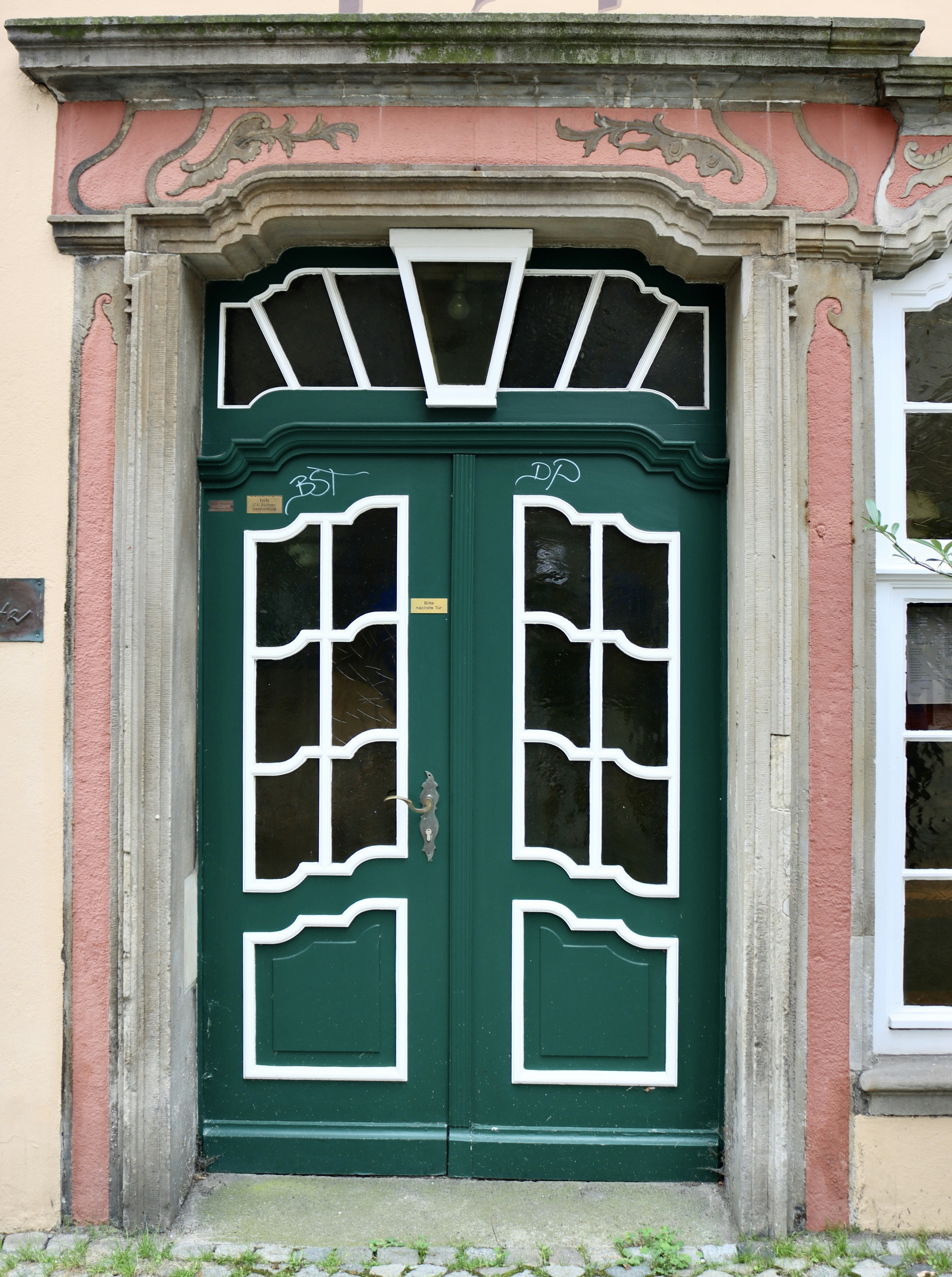 Emerald Double Door in a Baroque Facade