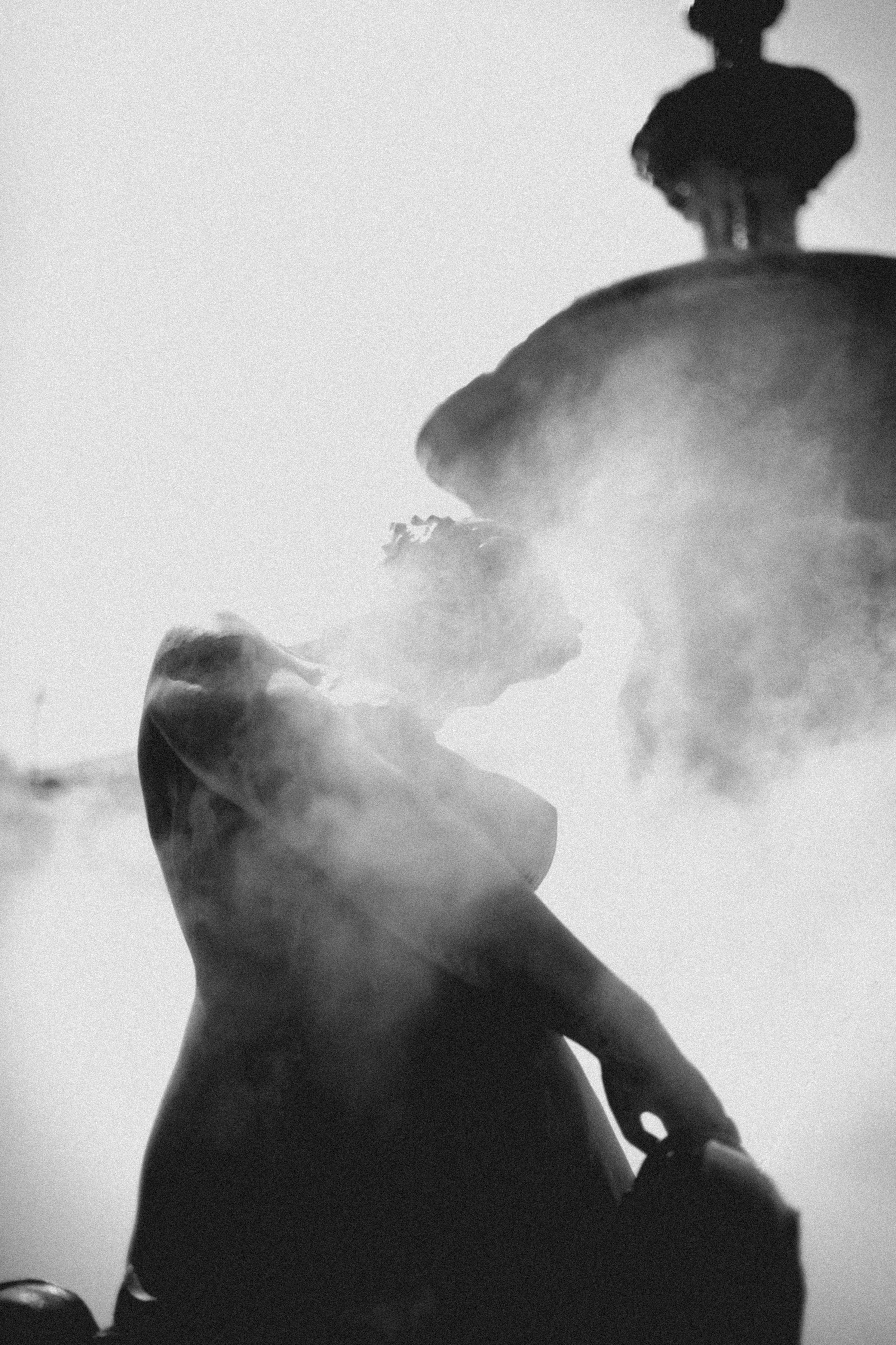 Steam-veiled Silhouette Beneath a Monumental Crest