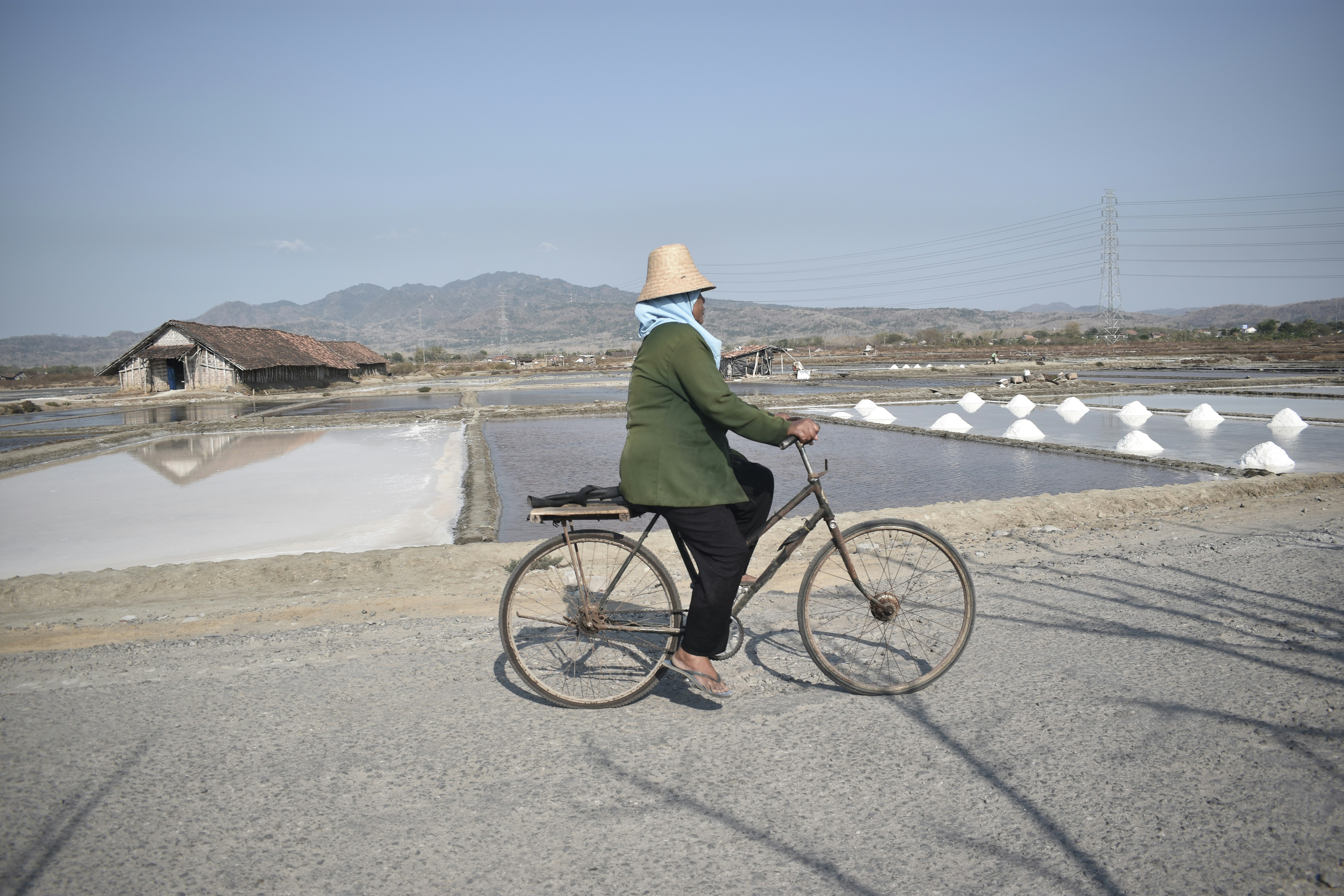 Cyclist Journeying Through Salt Fields