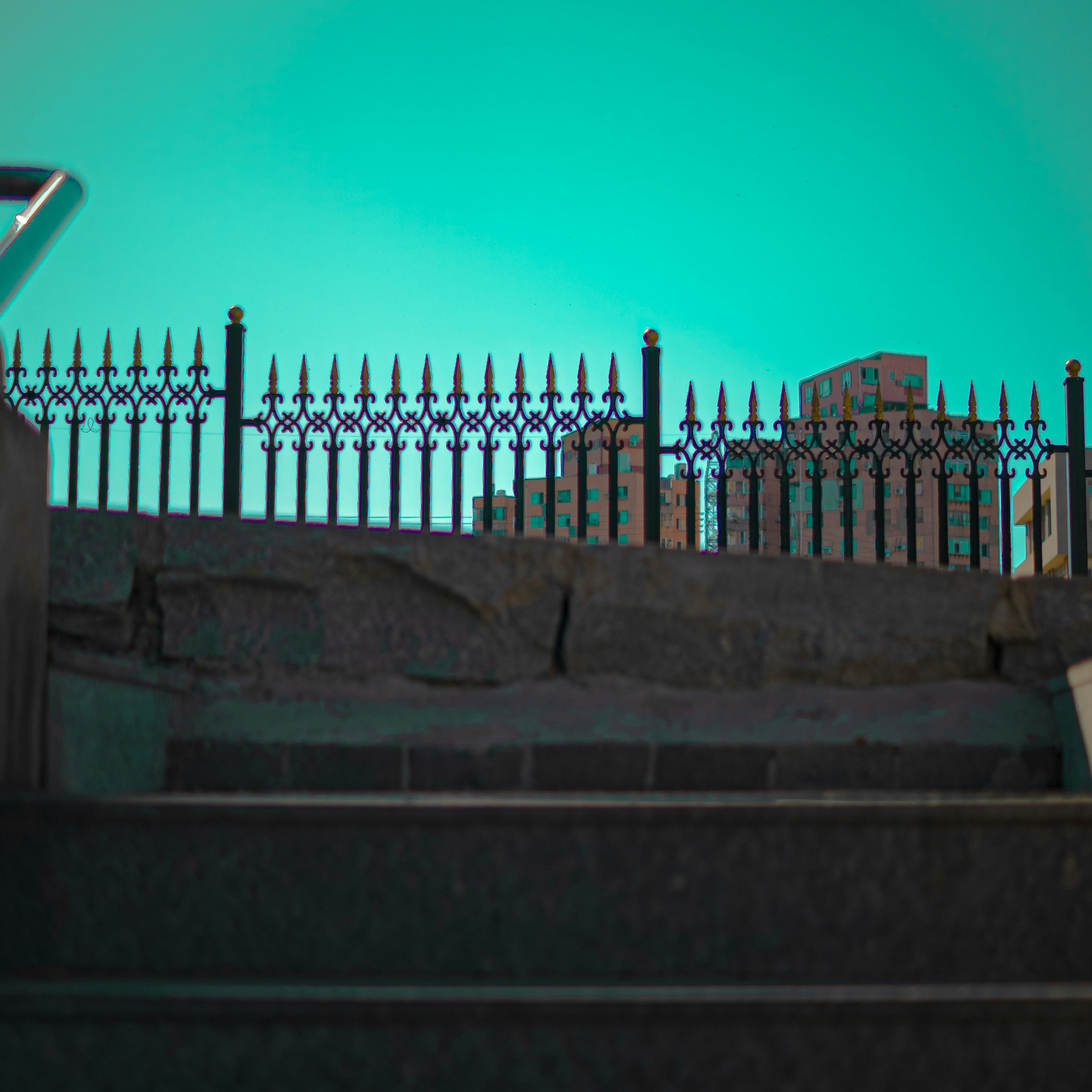 Ironwork on a City Stair: A Bold Silhouette Above the Steps