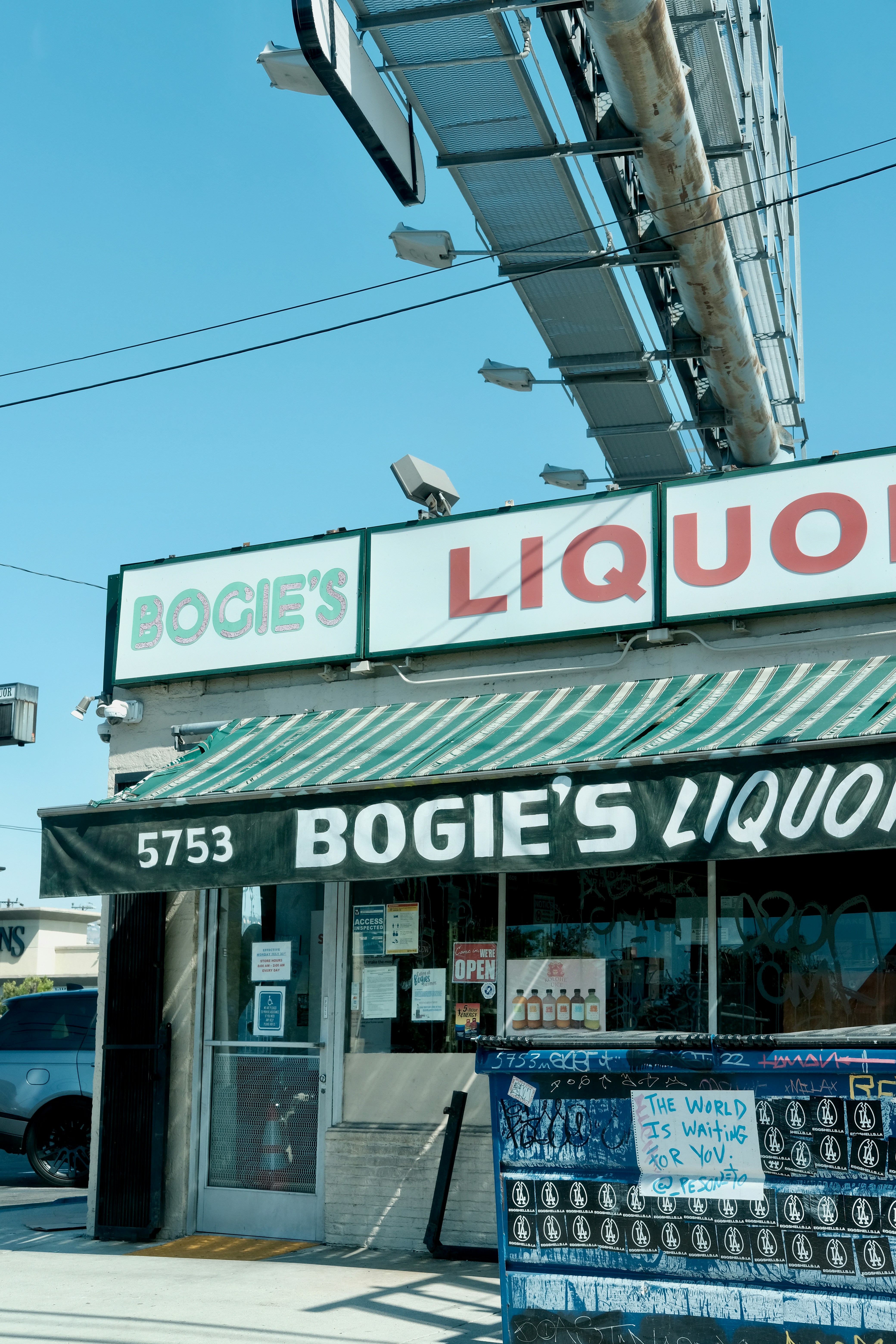 A liquor store on a city street corner photo – Free Liquor store Image ...