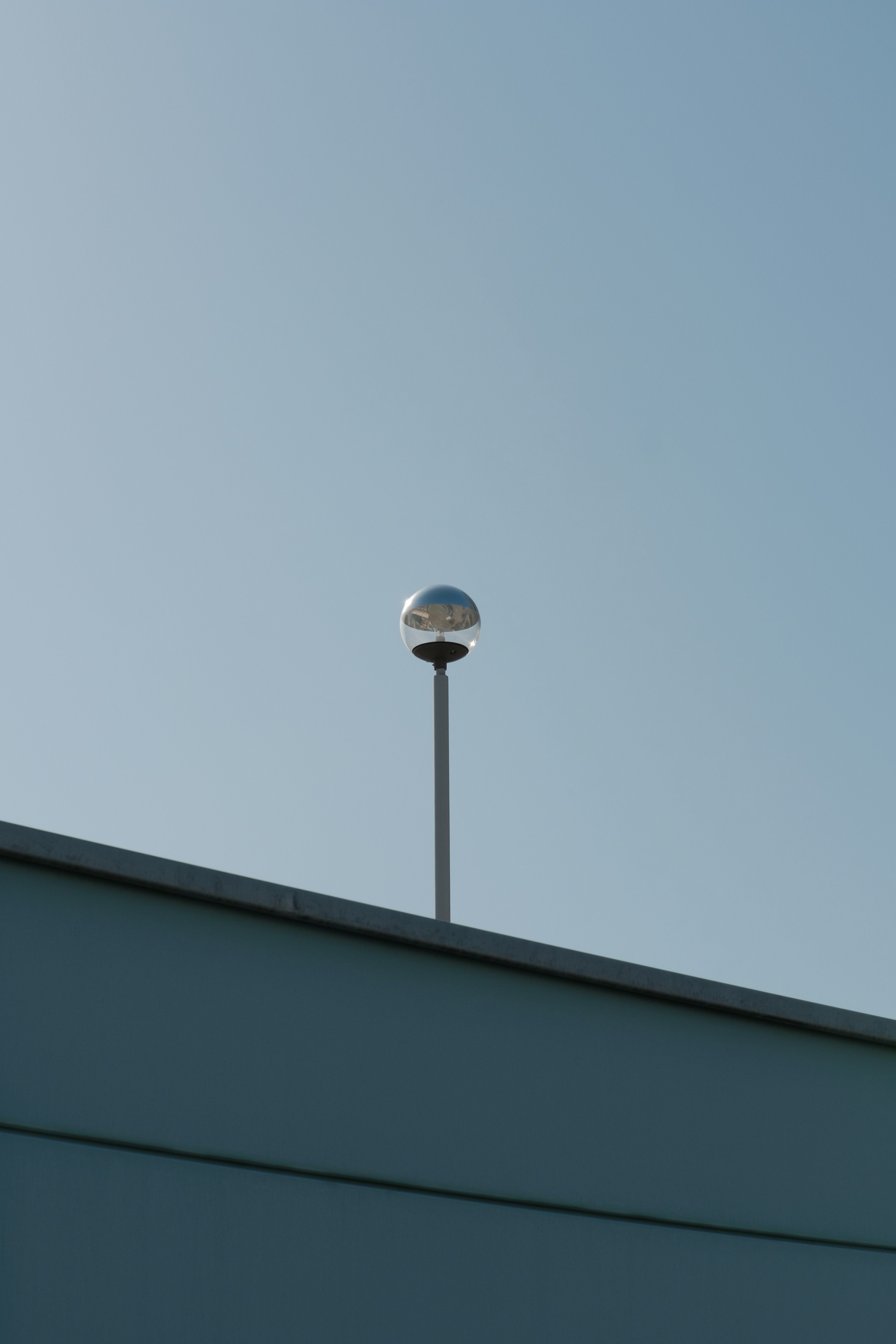 Glass-Globe on a Skyline: A Minimalist Rooftop Moment
