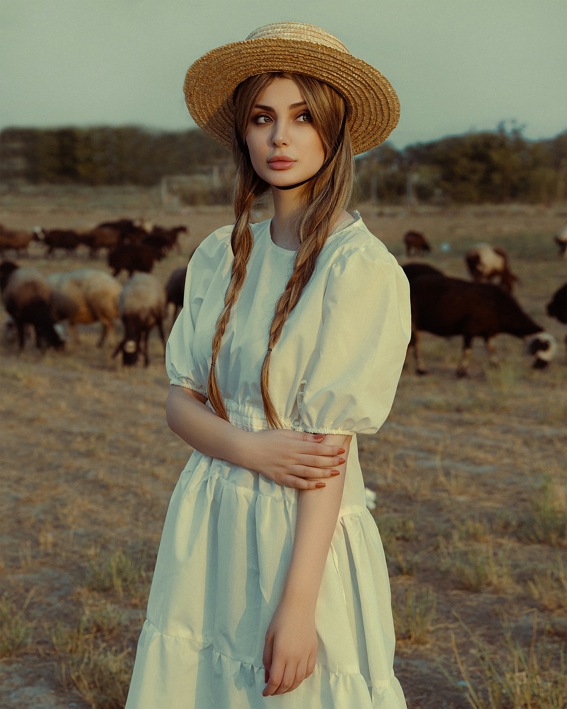 Straw-Hatted Solace: A Portrait in a Field of Cattle