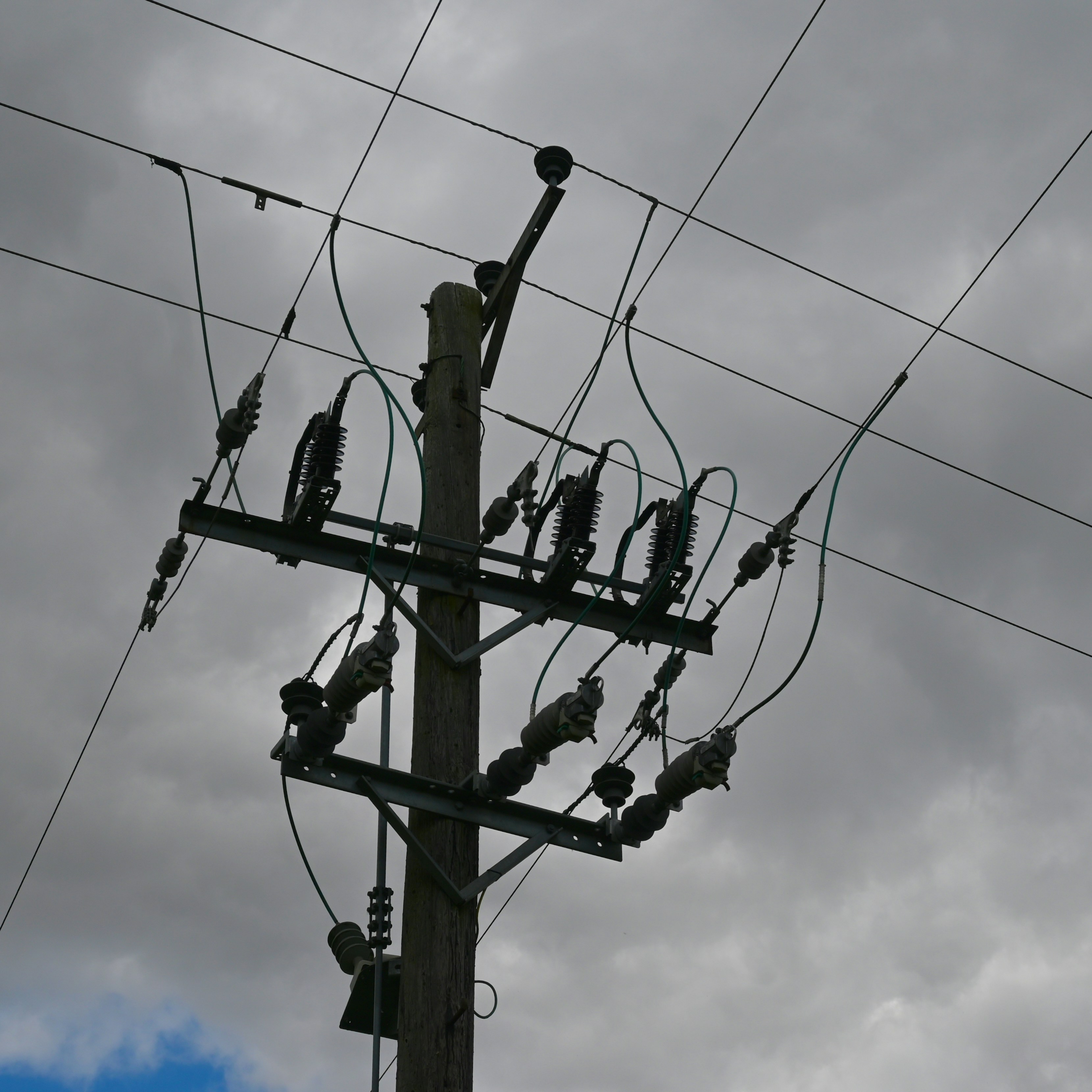 A telephone pole with many wires and wires attached to it photo – Free ...