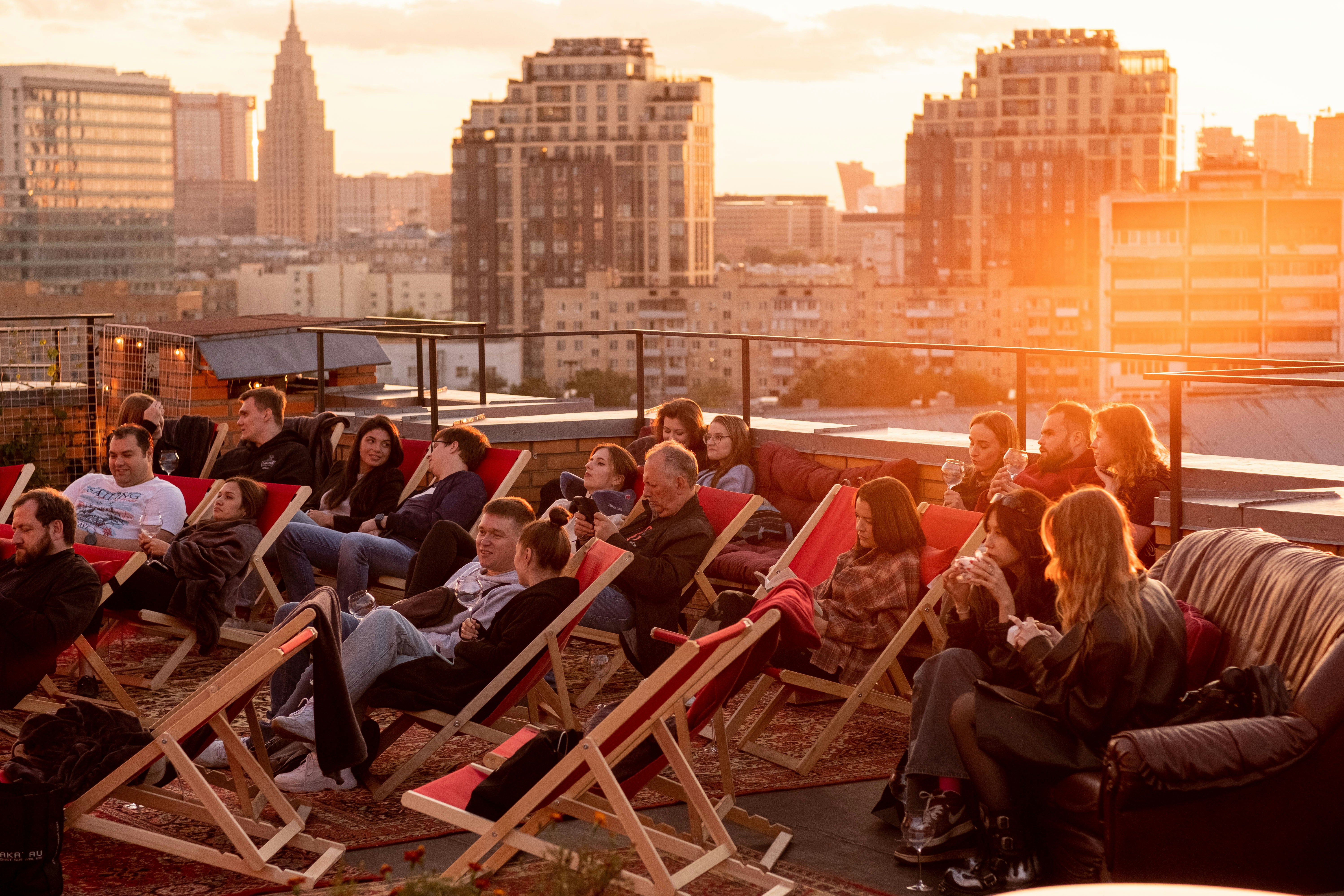Golden Hour Rendezvous on a Rooftop: Quiet Moments Under a City Skyline