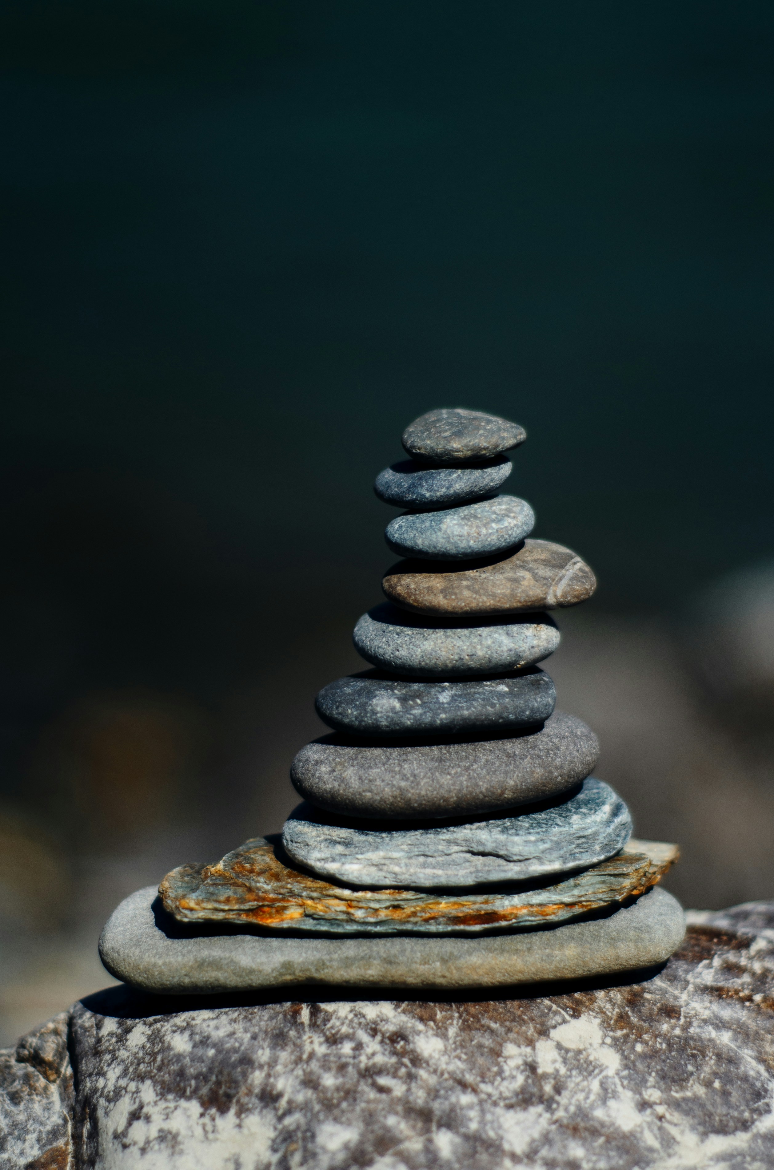 A stack of rocks sitting on top of a rock photo – Free Rust Image on ...
