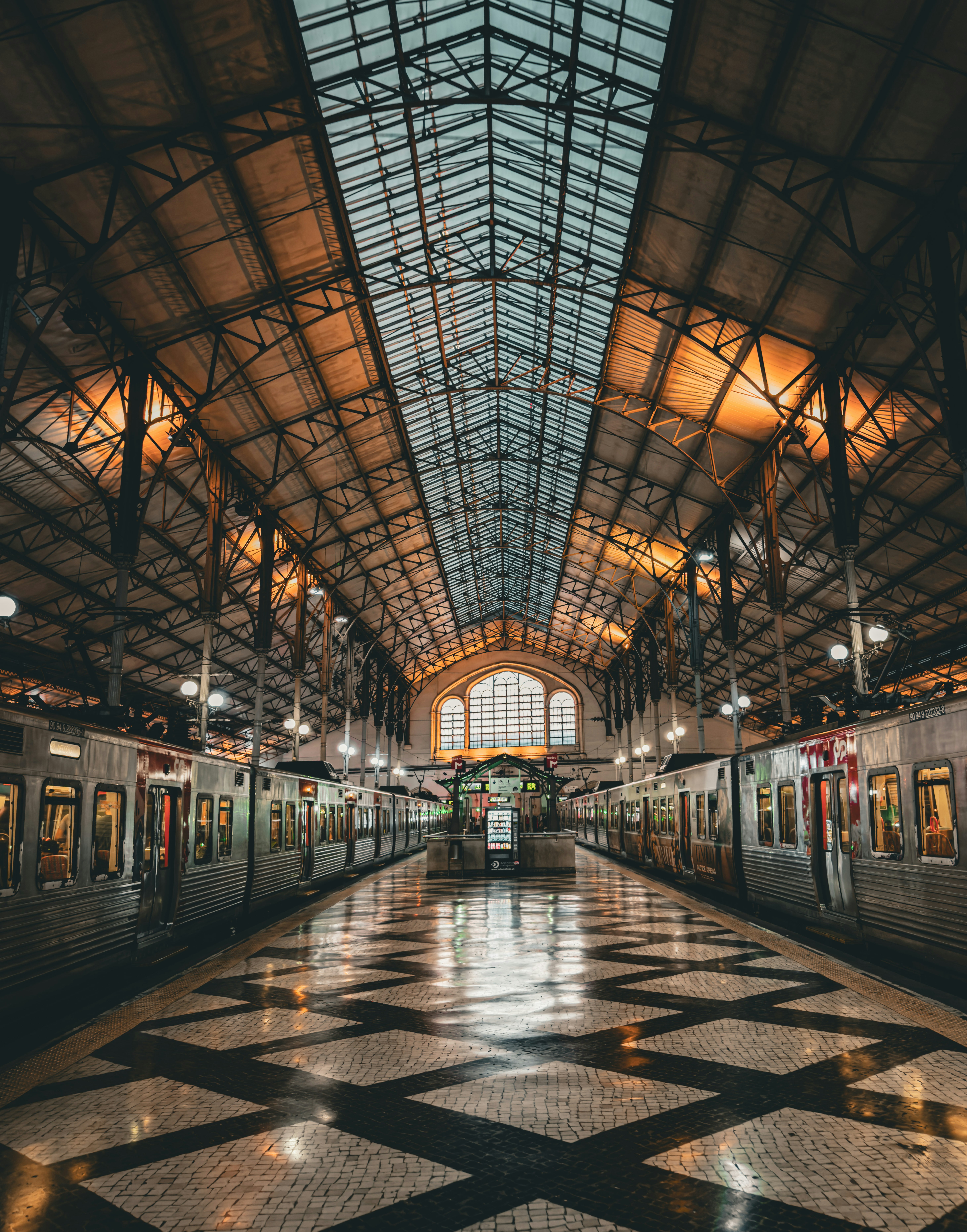 A train station with a checkered floor and a skylight photo – Free ...