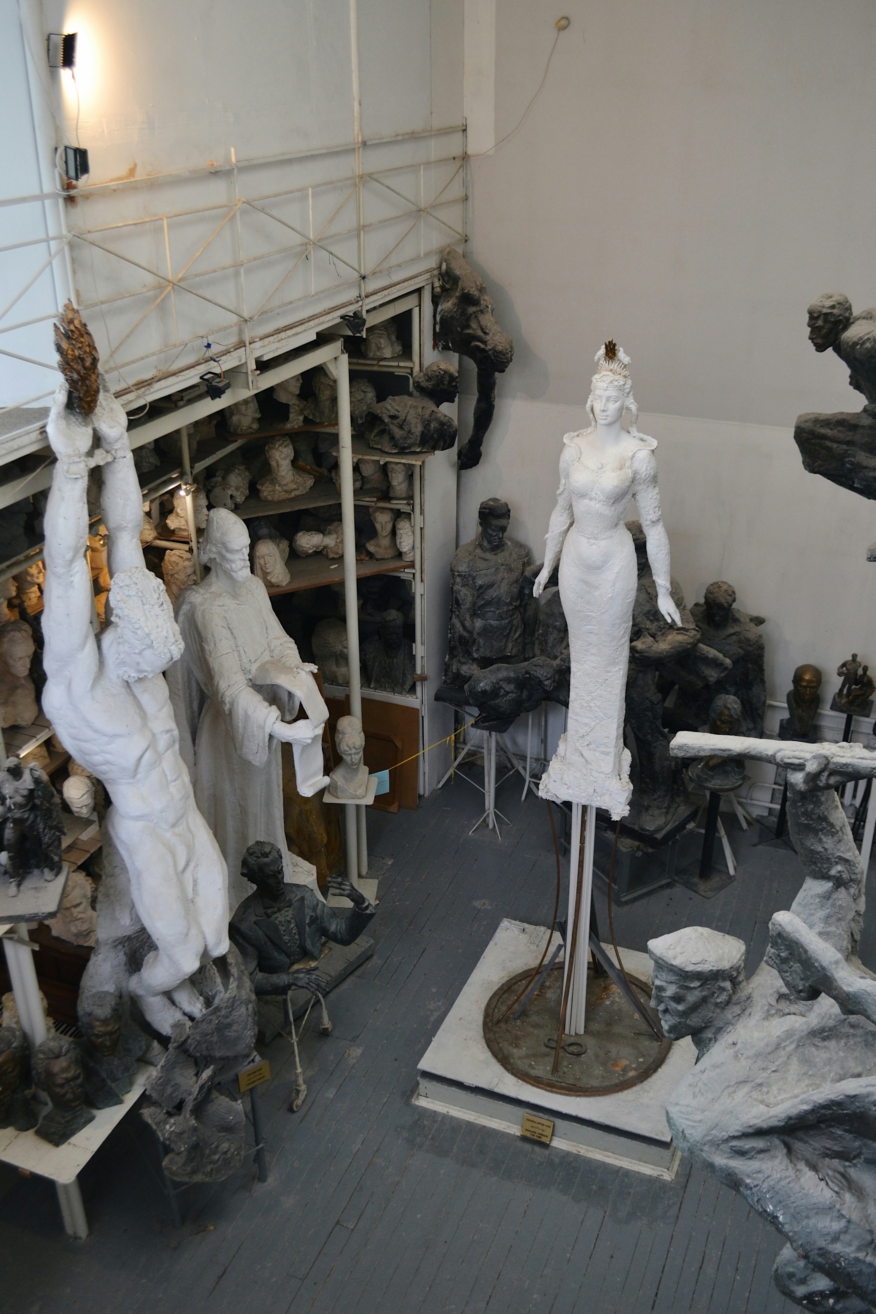 A room filled with lots of different types of mannequins photo – Free ...