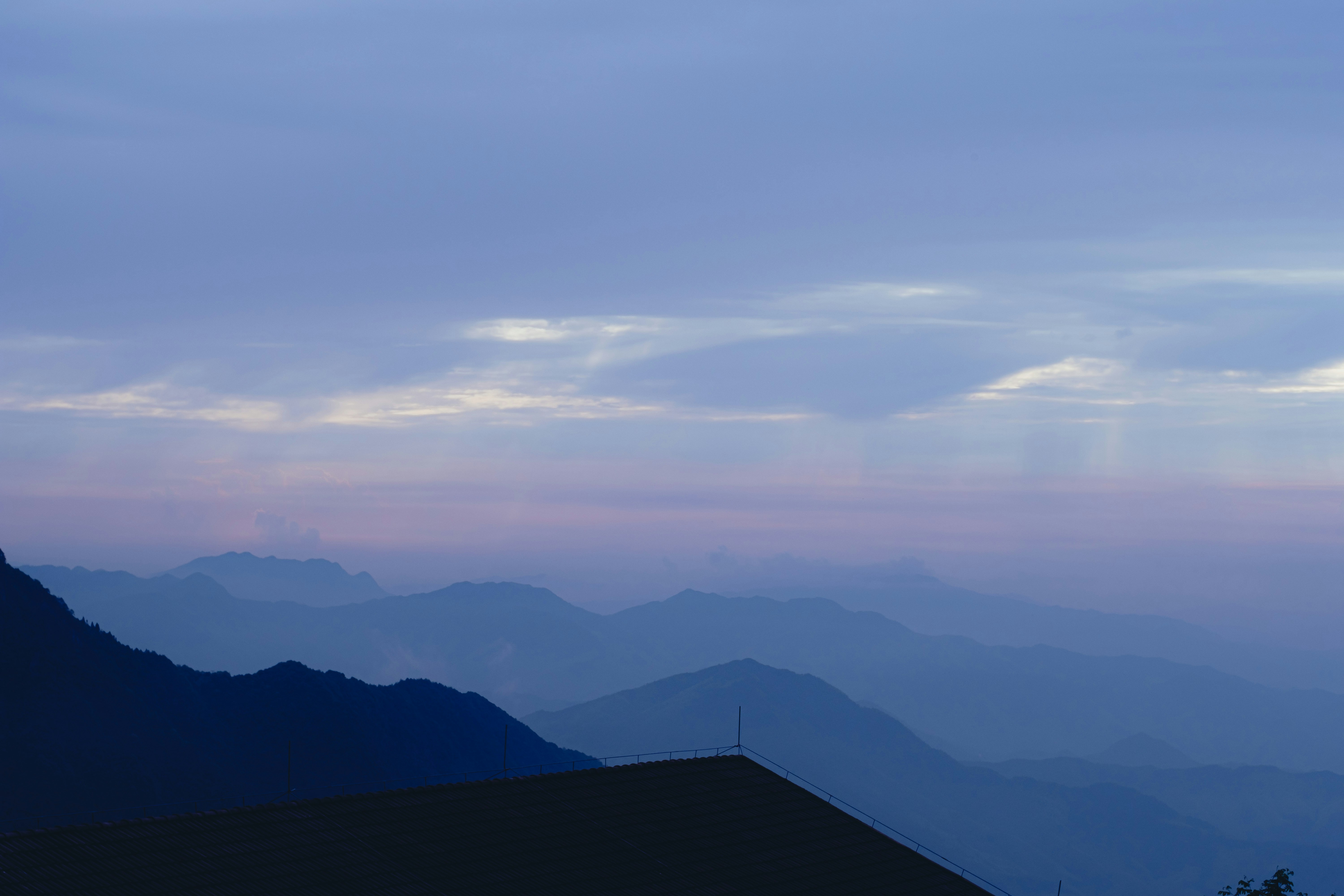 A view of a mountain range at dusk photo – Free Nature Image on Unsplash
