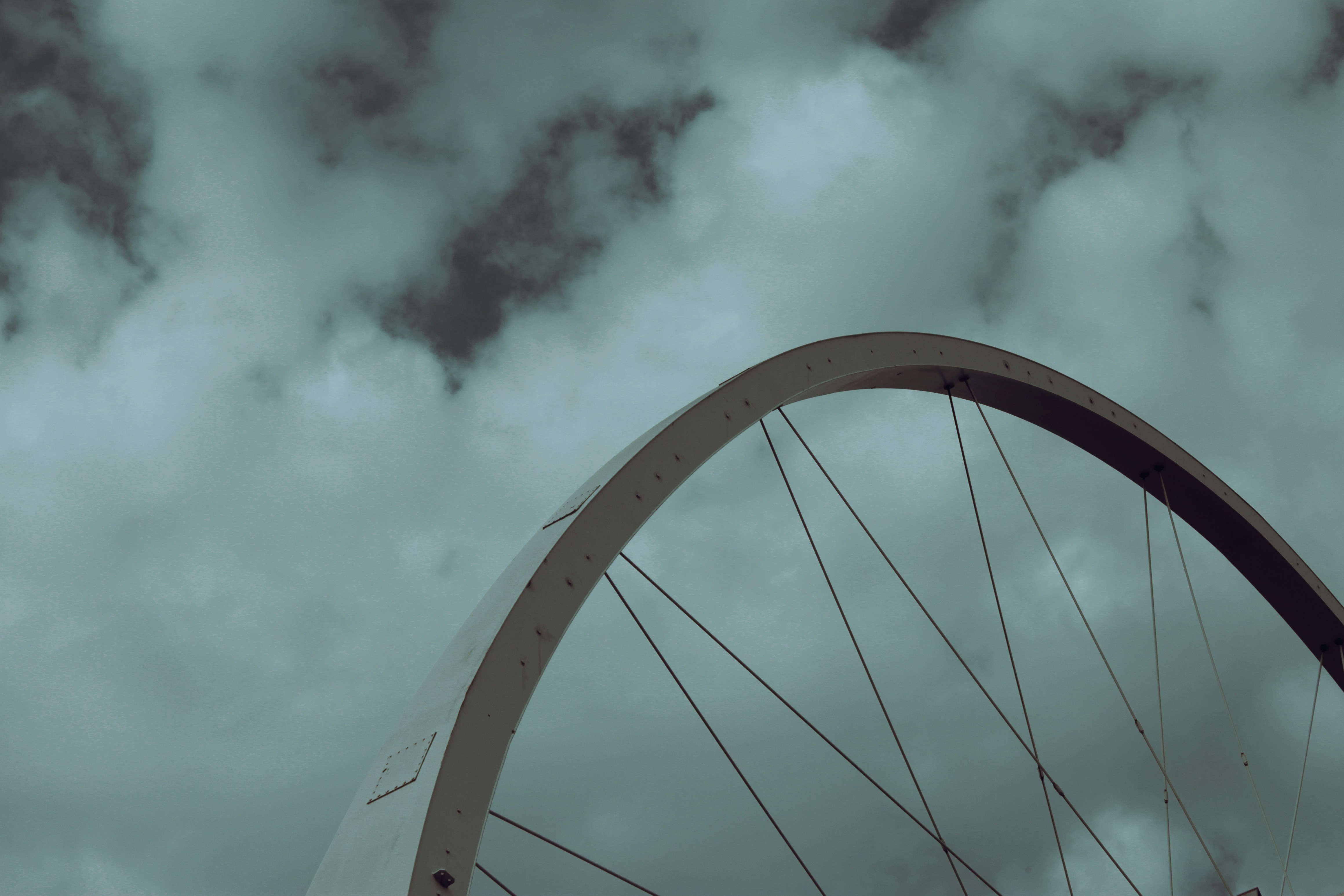 Arc of Steel: Framed Cables Against a Skybound Ring