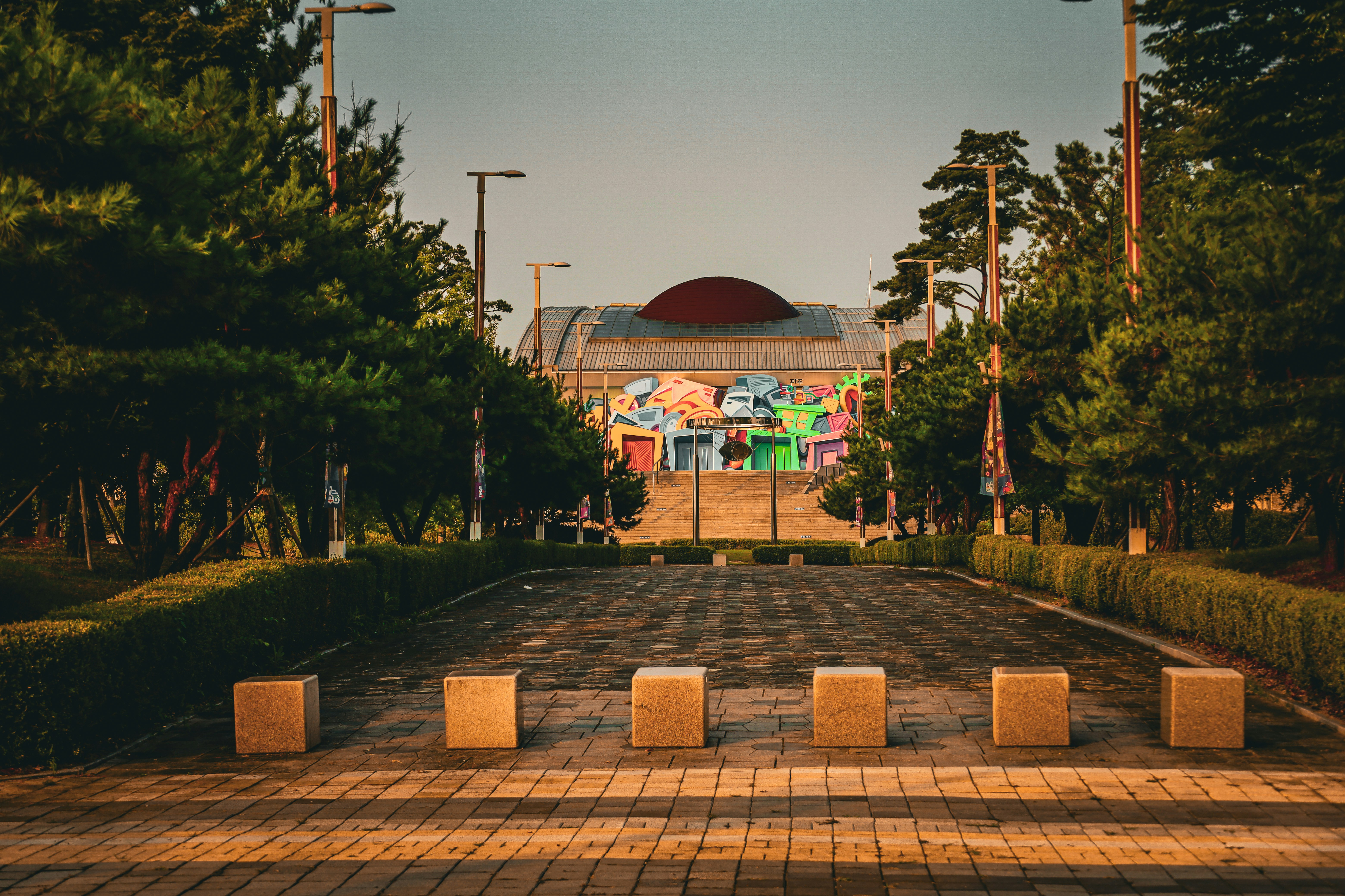 Centerline Convergence: A Sunset Walk Toward the Painted Dome