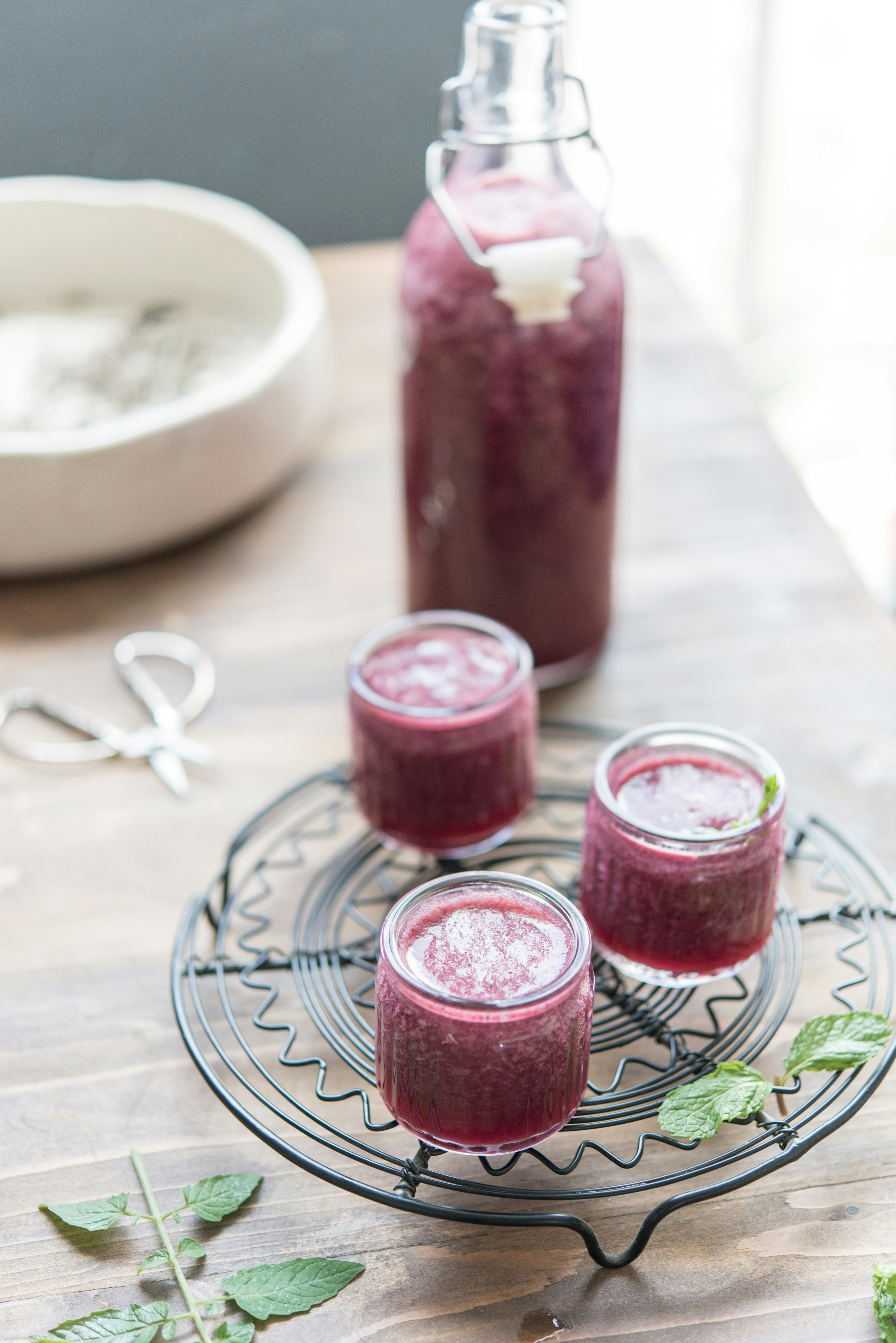 Crimson Trio: Purple Jam Jars on a Rustic Wire Rack