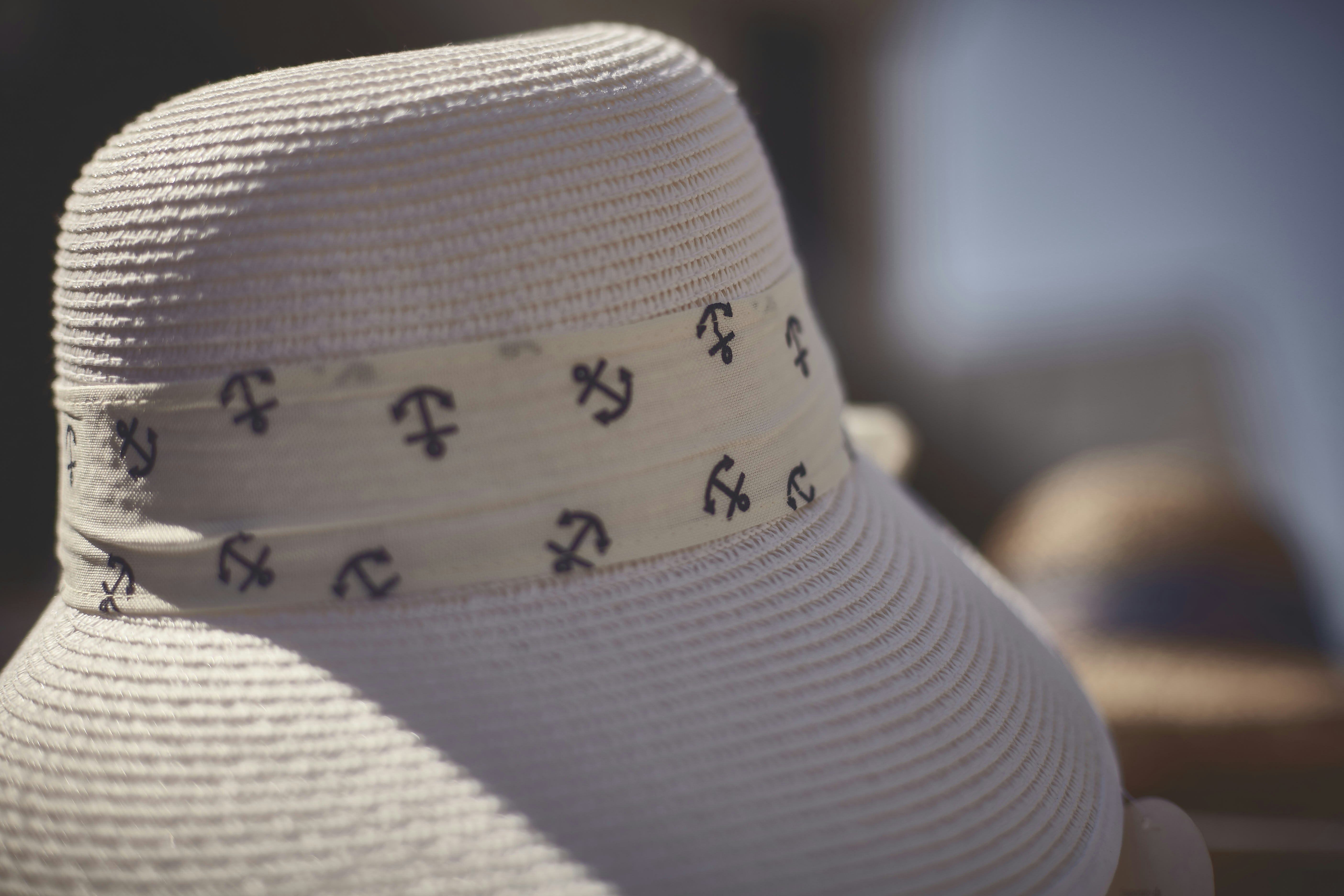 Anchor-Banded Straw Hat in a Sunlit, Soft-Focused Close-Up