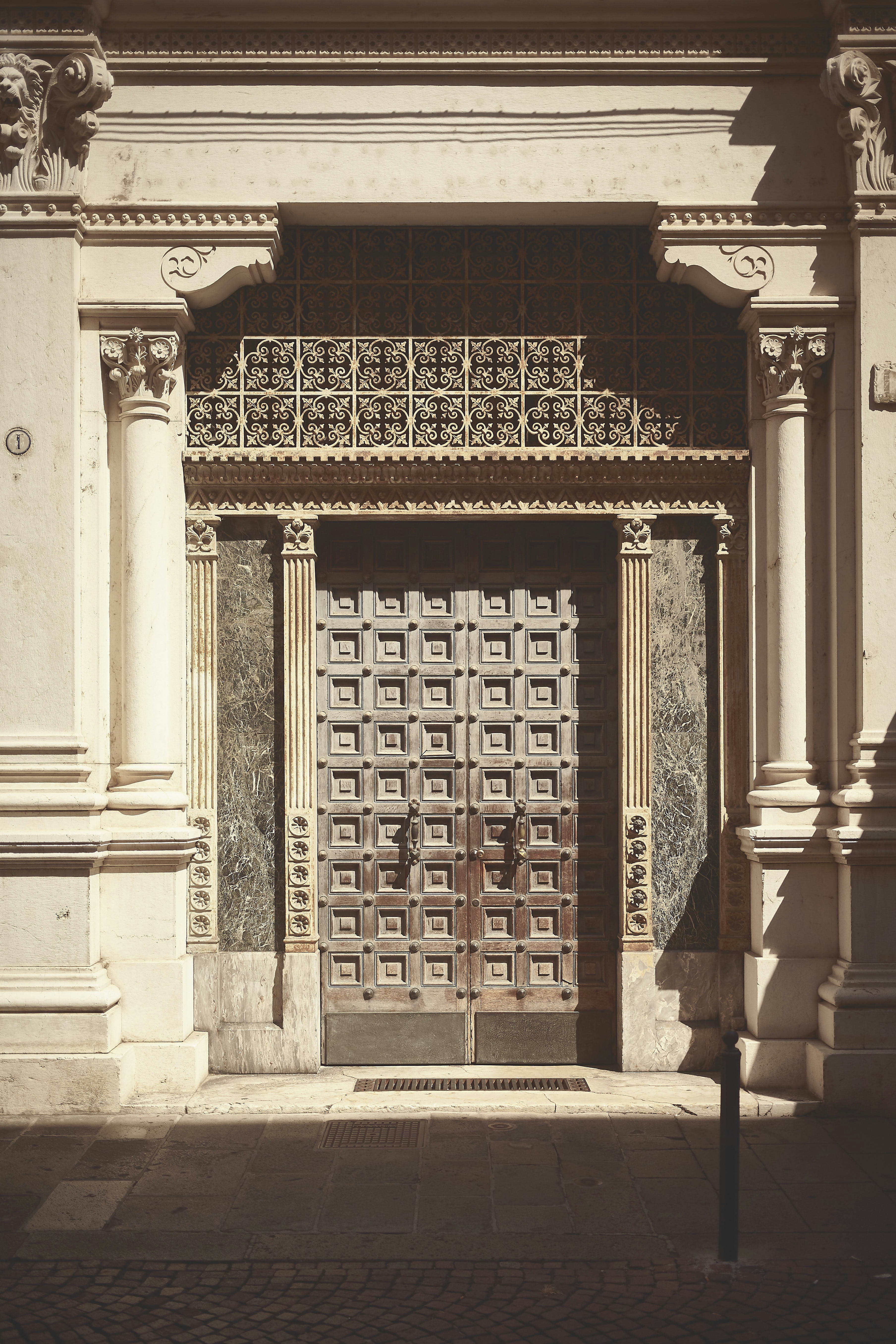 Sepia Portal: Carved Grandeur of a Monumental Doorway