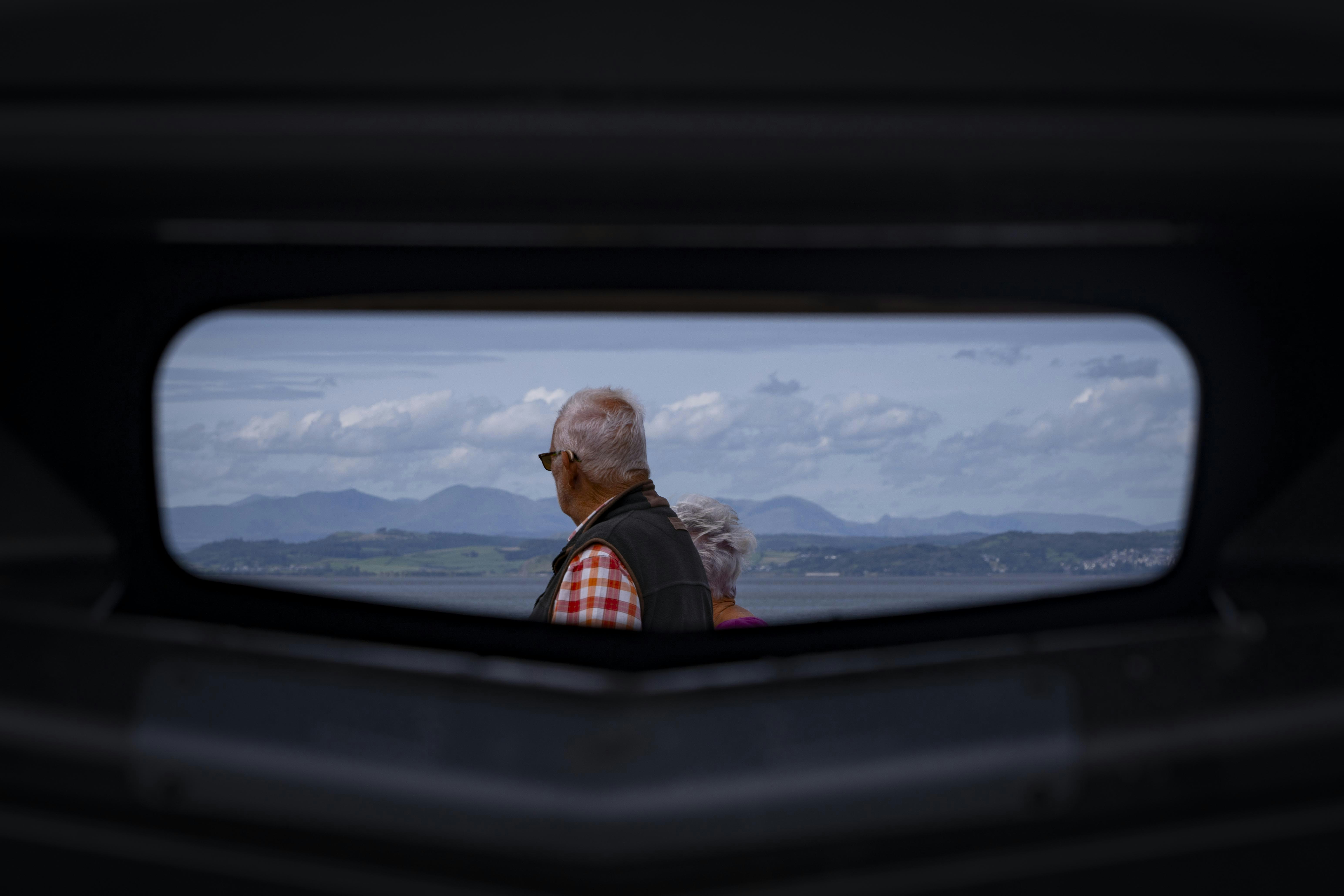 Rear-view Window Portrait: A Traveler’s Quiet Moment
