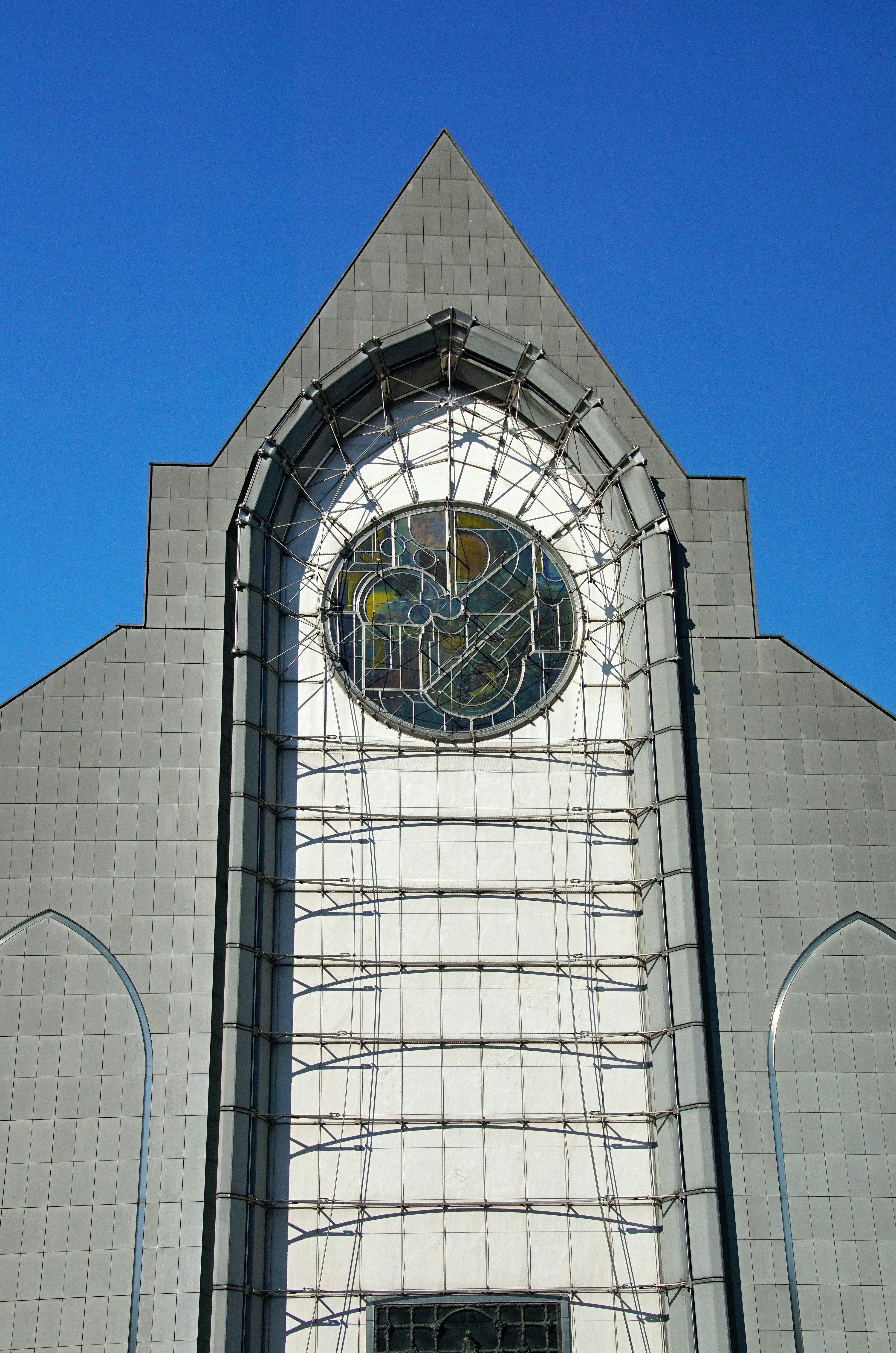 The modern, imposing facade of the Lille Cathedral in France.