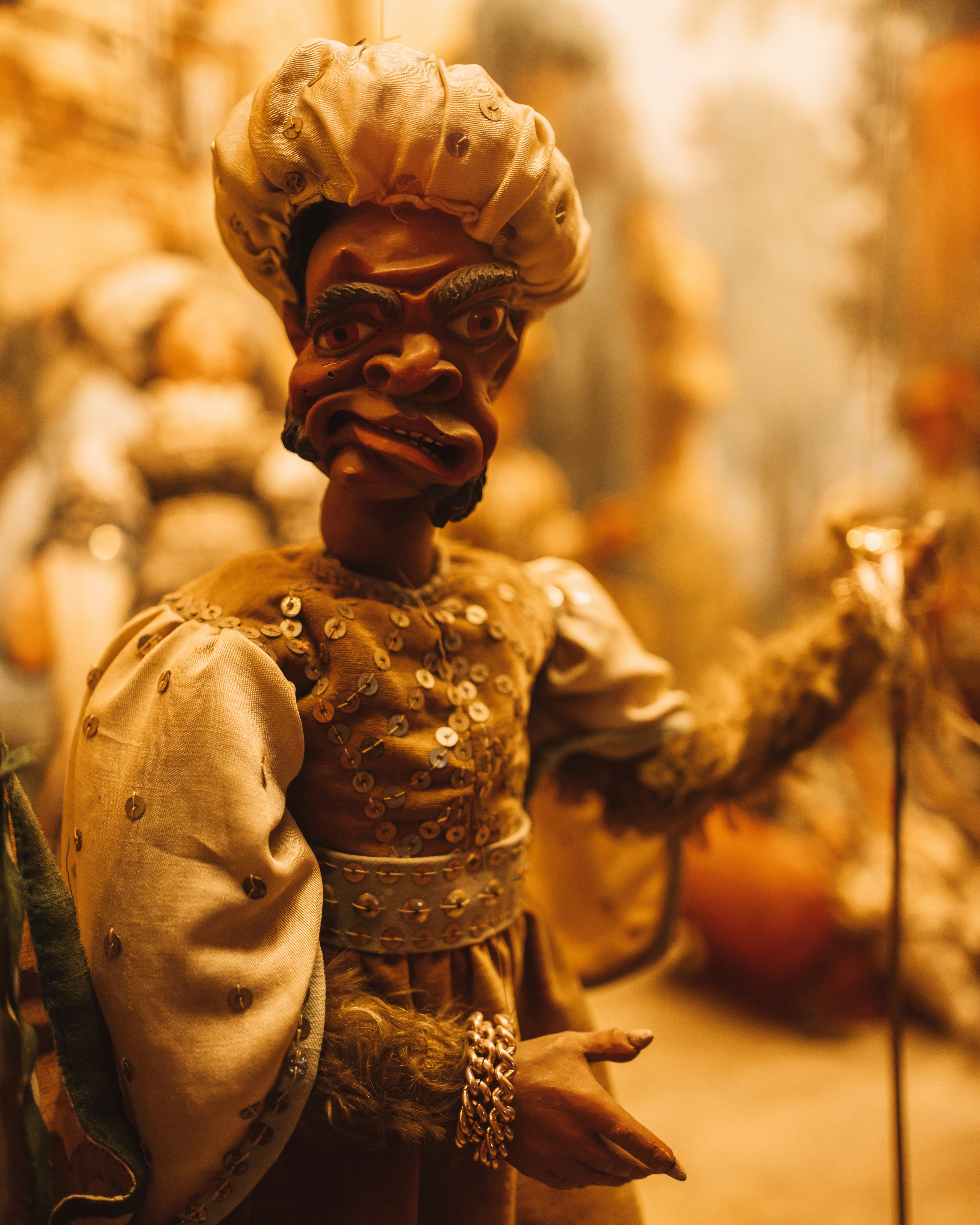 Masked Marionette in a Warm-Tinted Showcase
