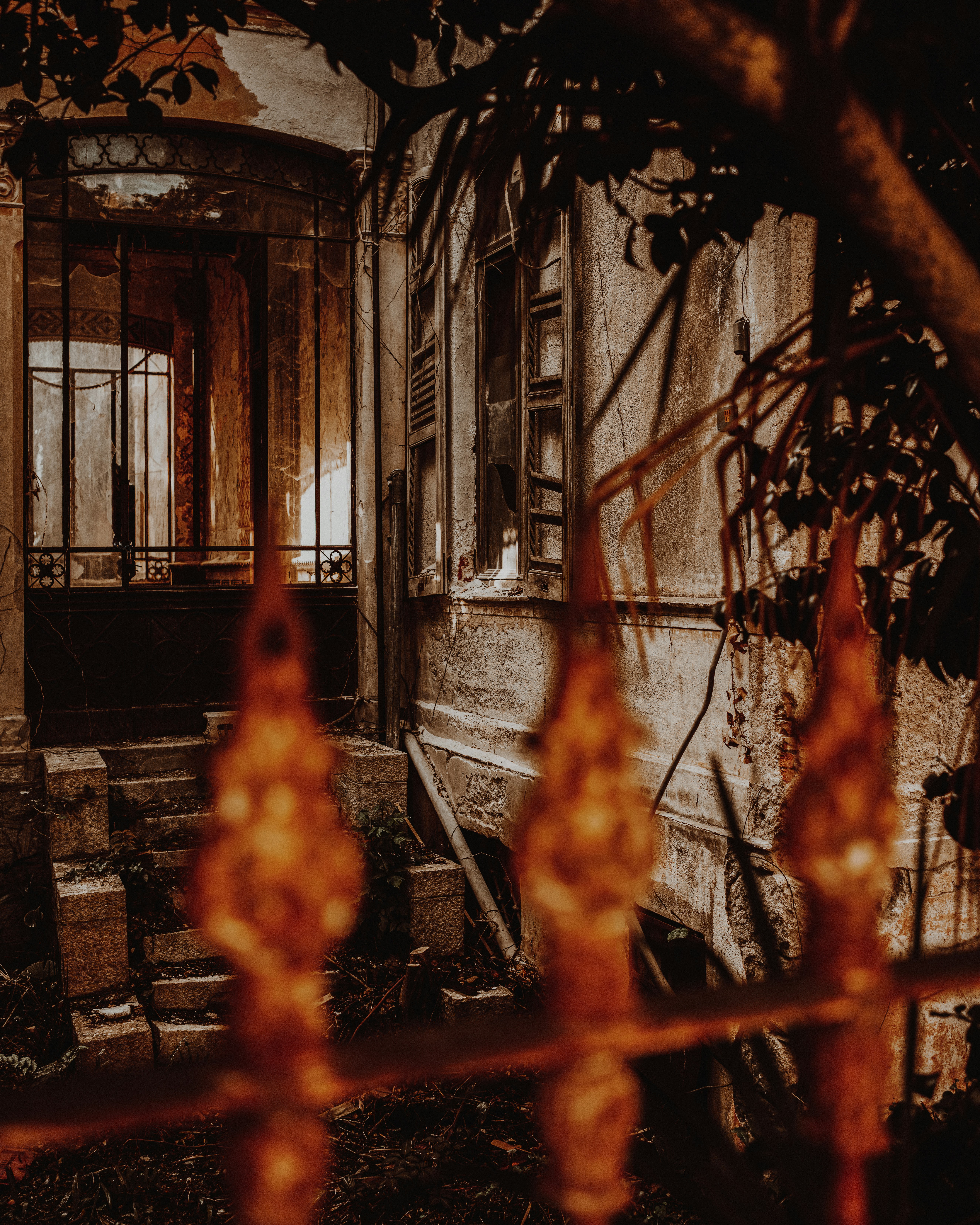 An old run down building with a fire hydrant in front of it photo ...