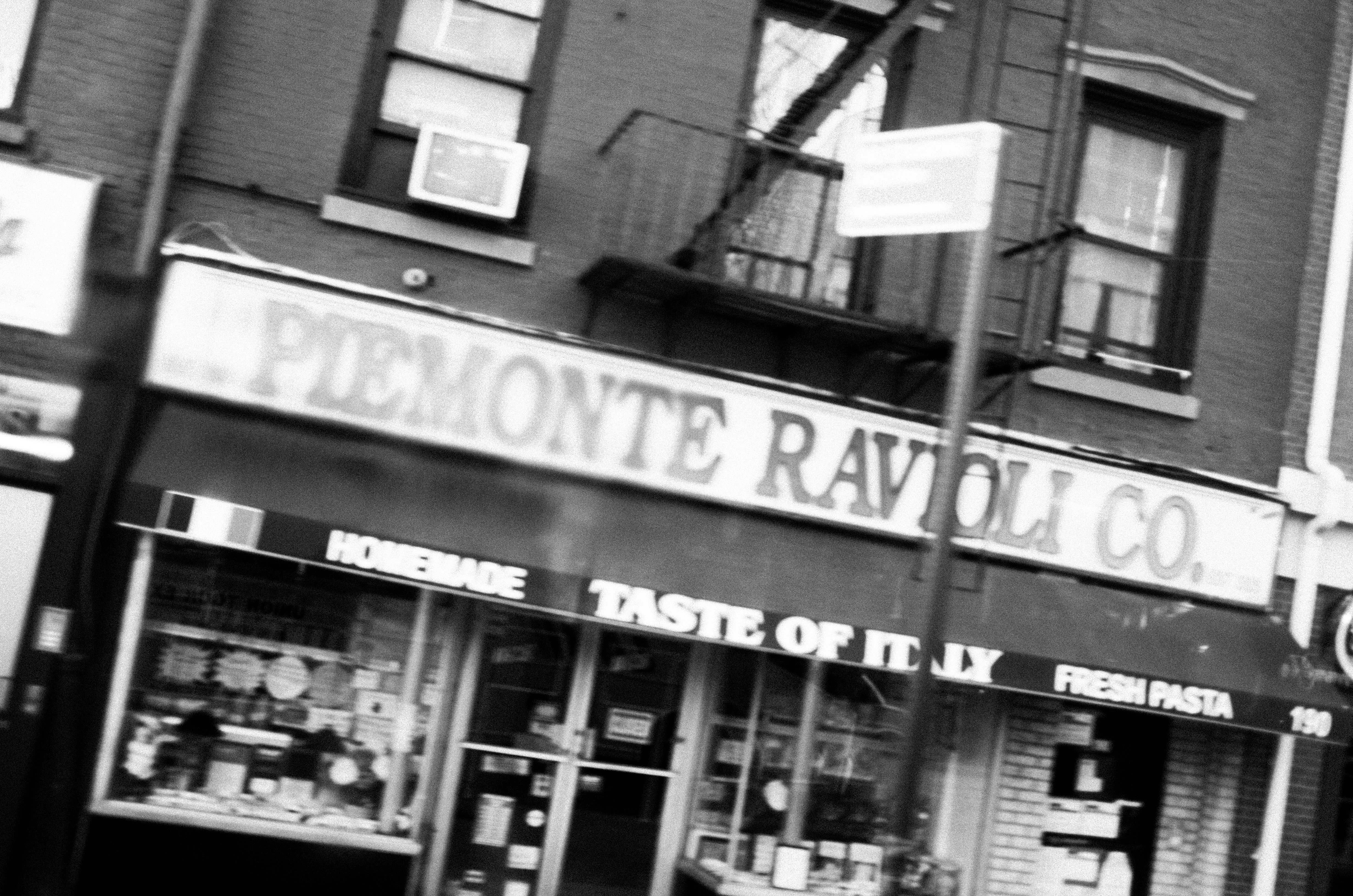 Pasta storefront in a tilted urban blur