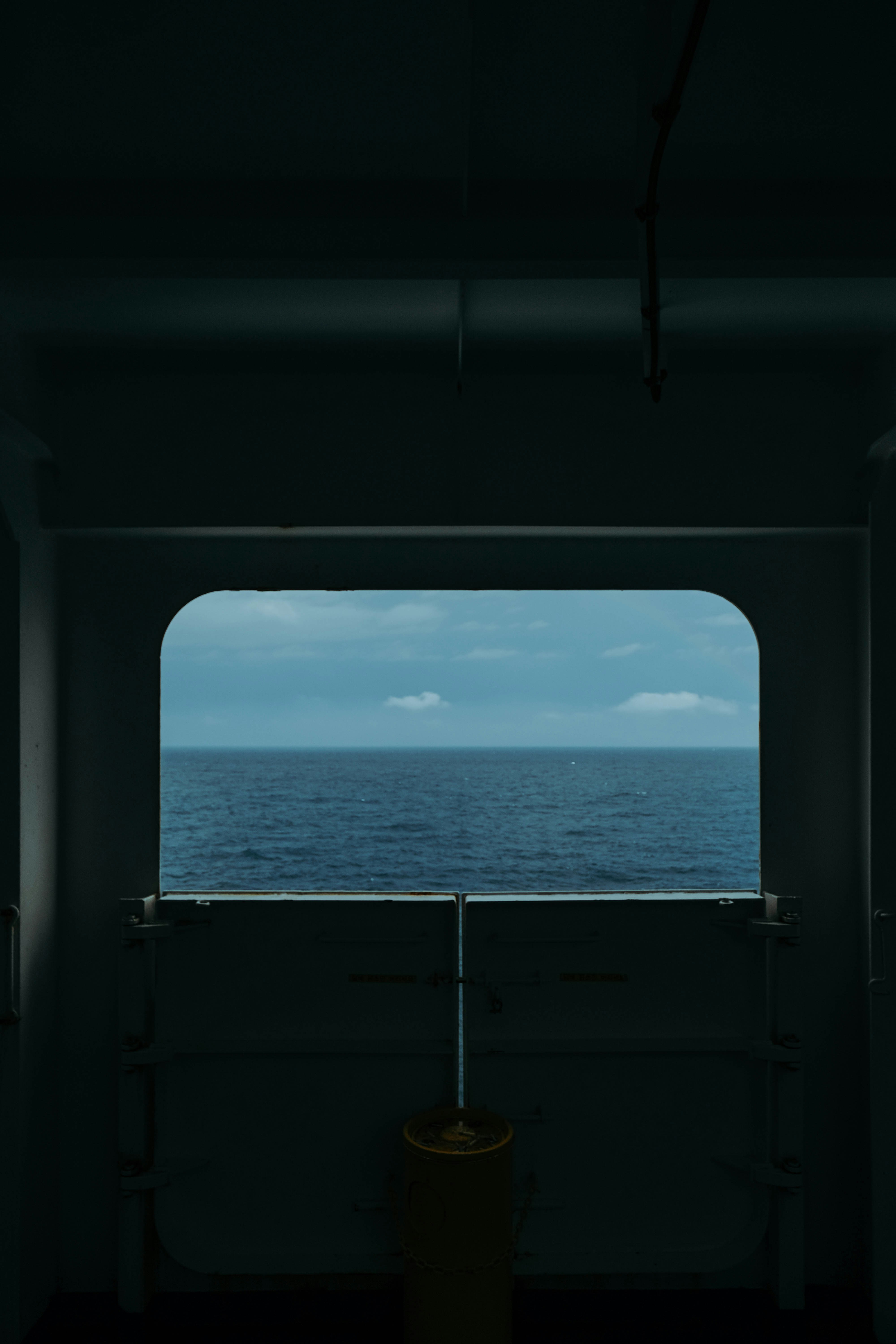 A view of the ocean through a window photo – Free Sea Image on Unsplash