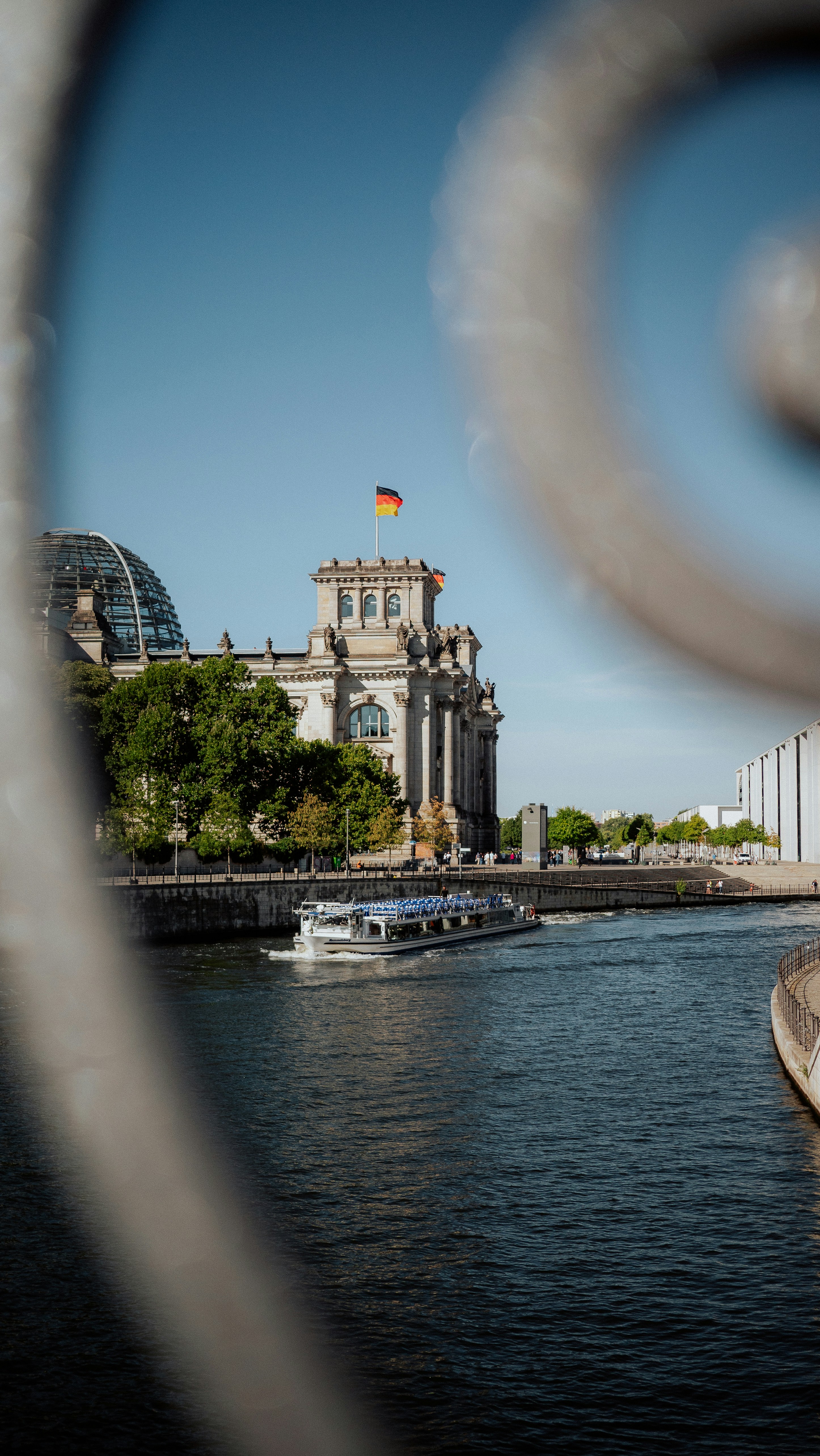 A view of a river with a building in the background photo – Free City ...