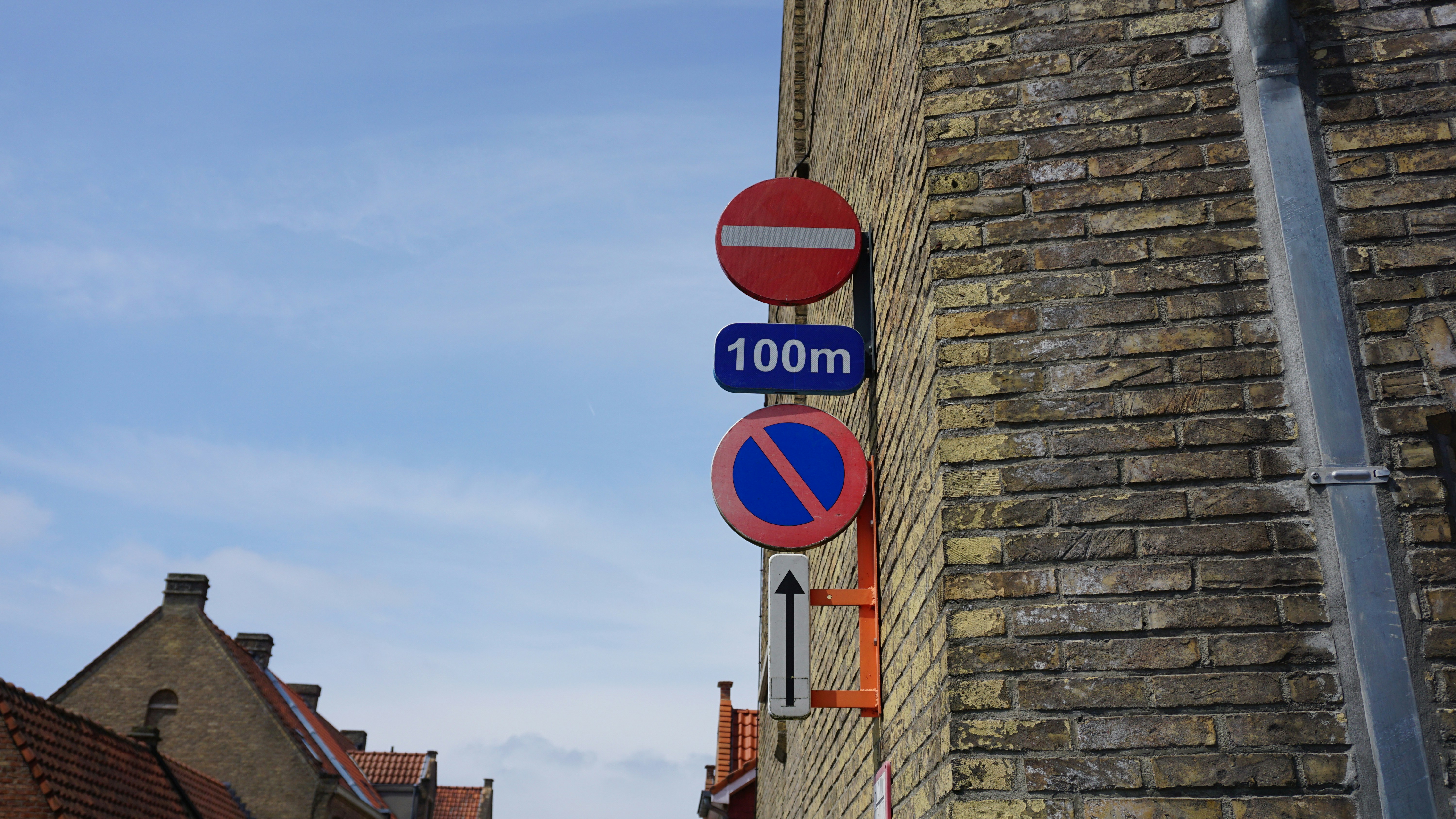 Street Sign Stack: A Clustered Marker Climb on Brick Wall