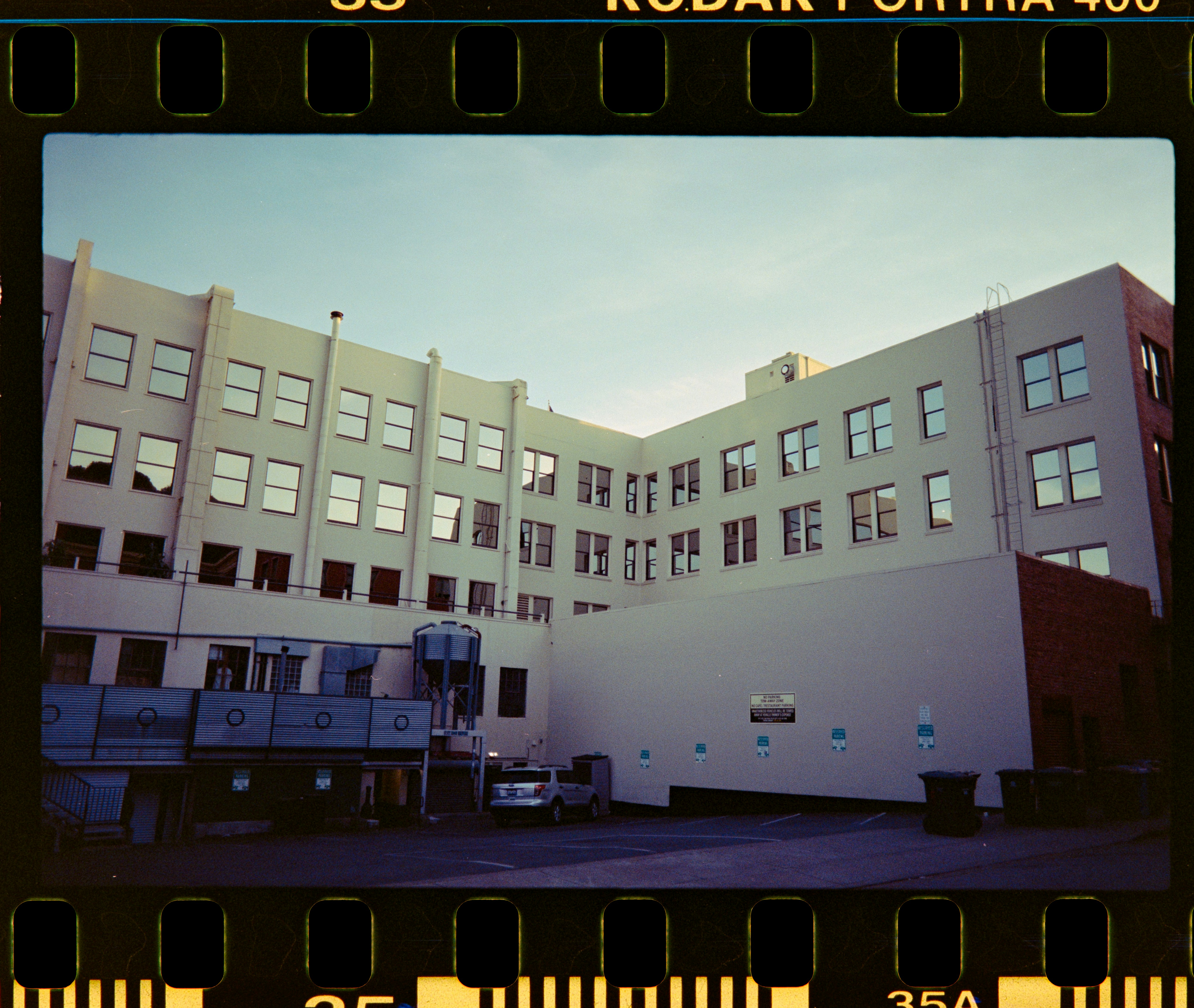 Pale U-shaped Campus Wing in Quiet Morning Light