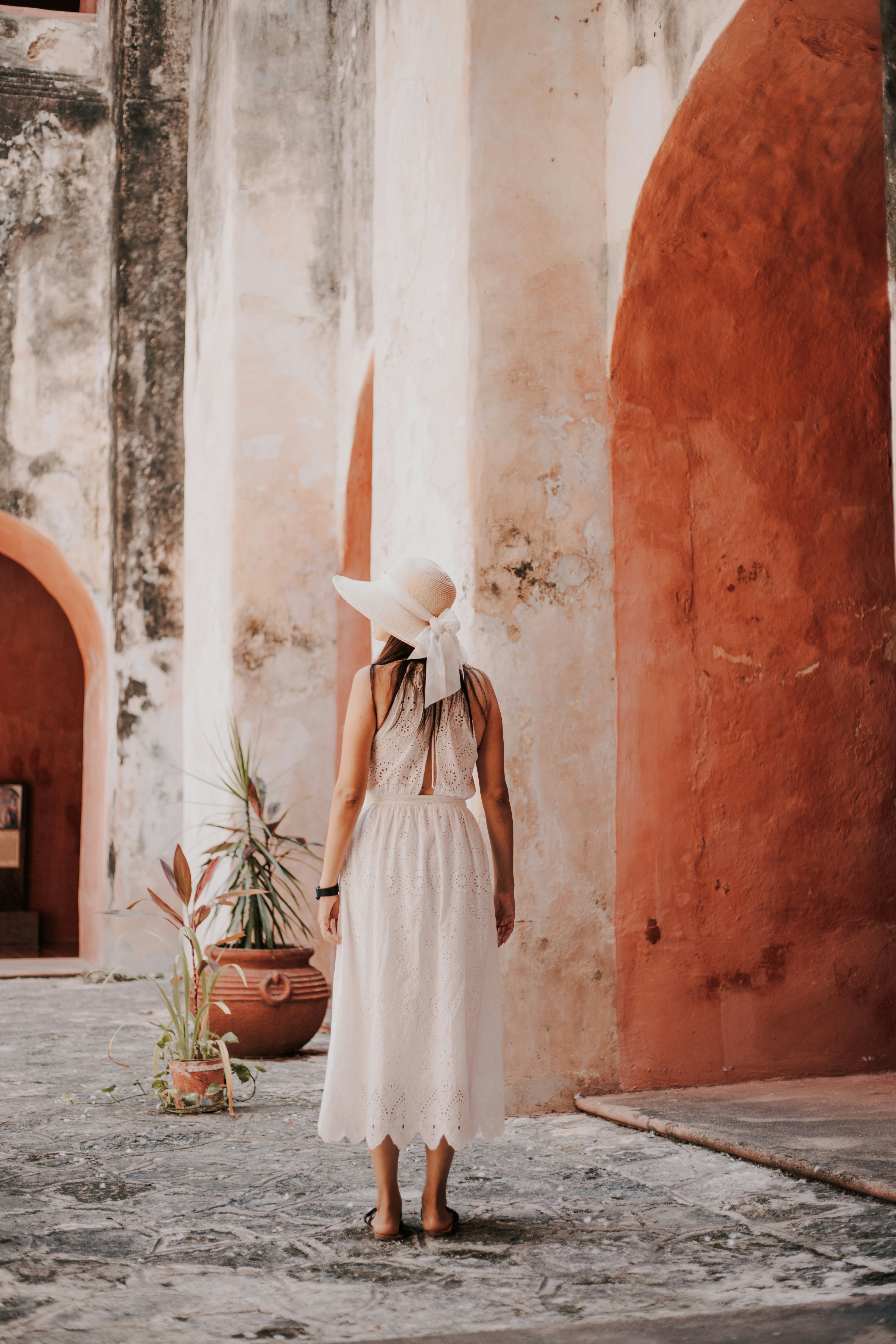 White Dress in a Sundrenched Arcade