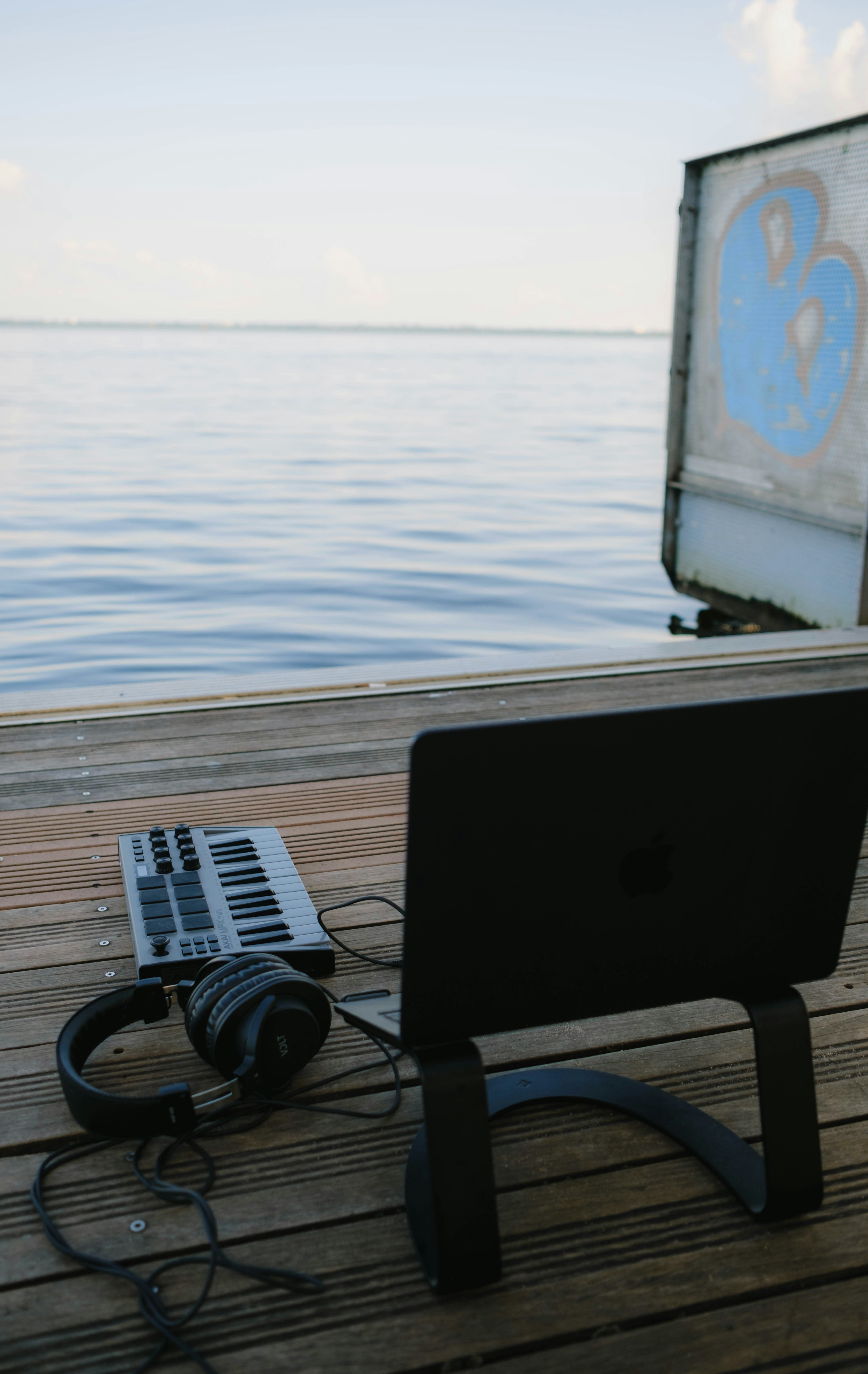 Dockside Studio: Laptop, Keyboard and Headphones by the Water