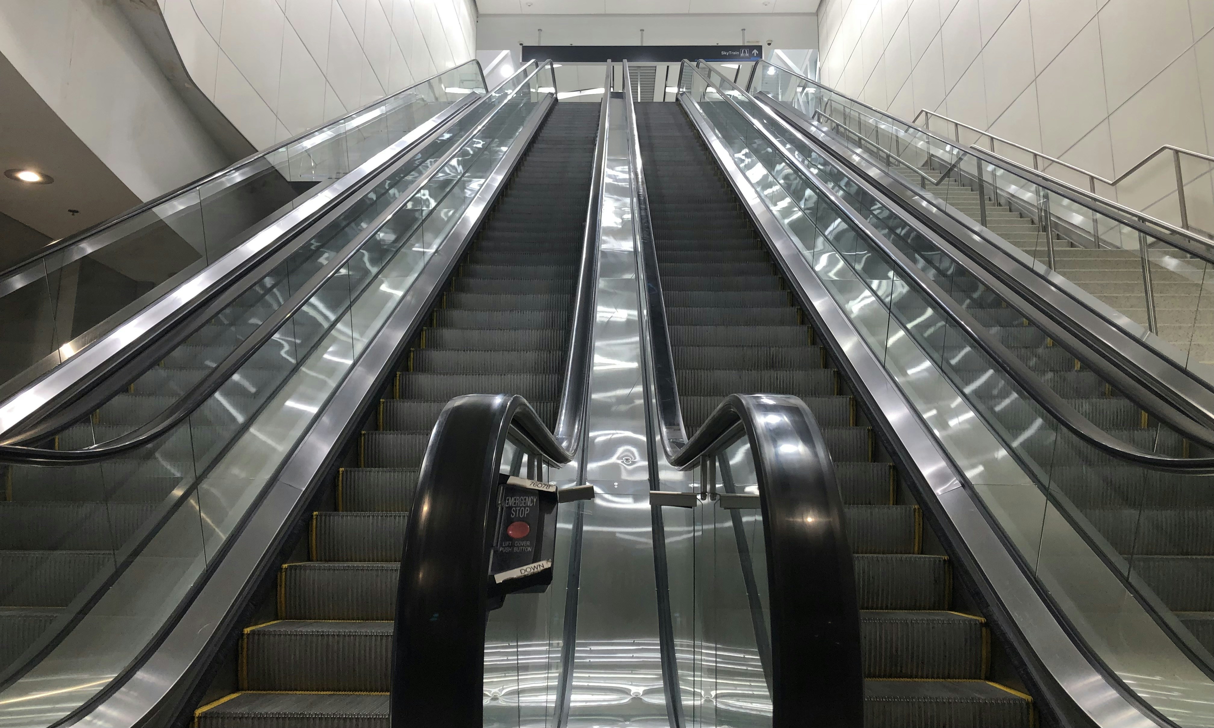 Convergence of Steel: Symmetrical Escalators Reaching for the Light