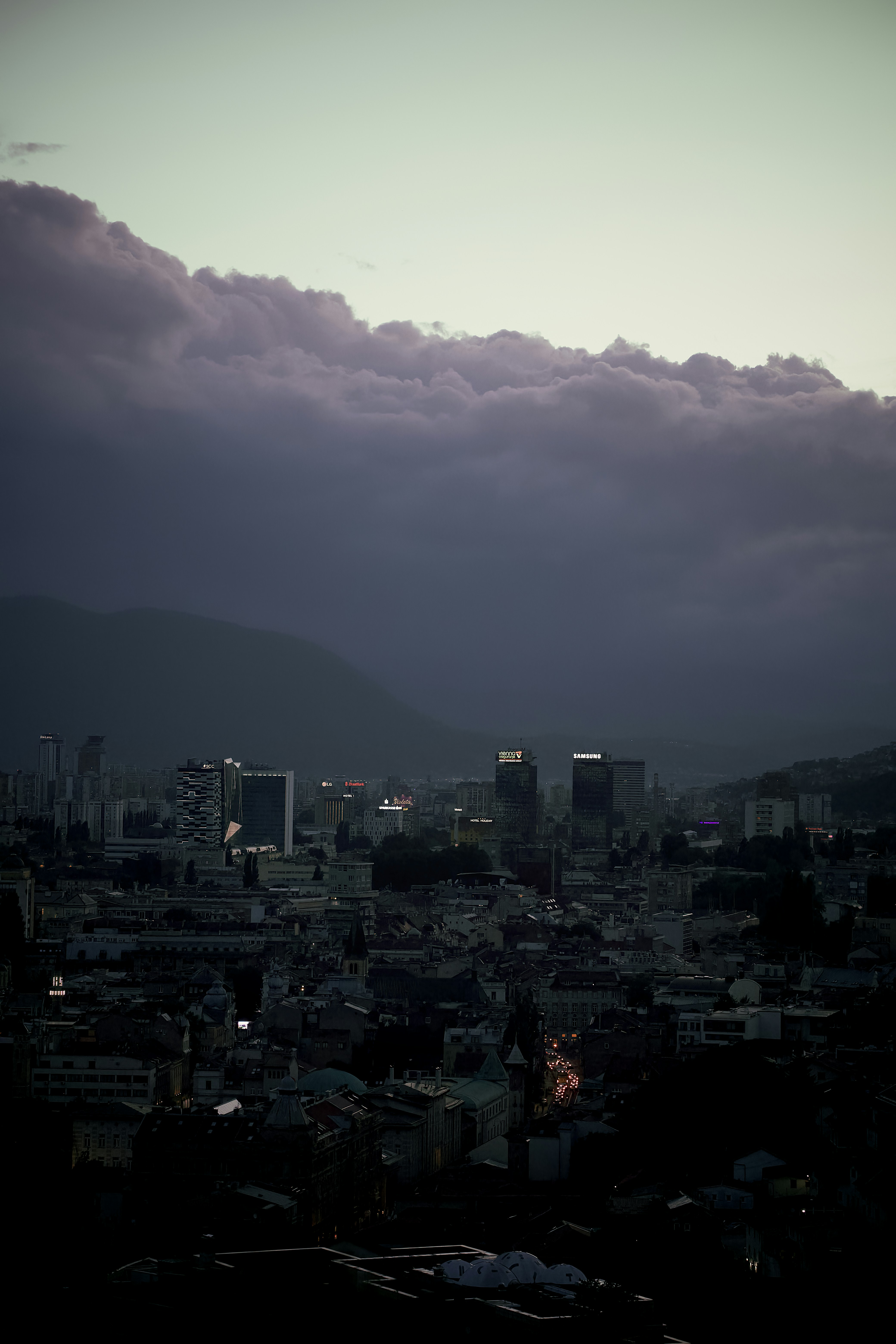 Dusk Skyline Beneath a Looming Cloud Bank