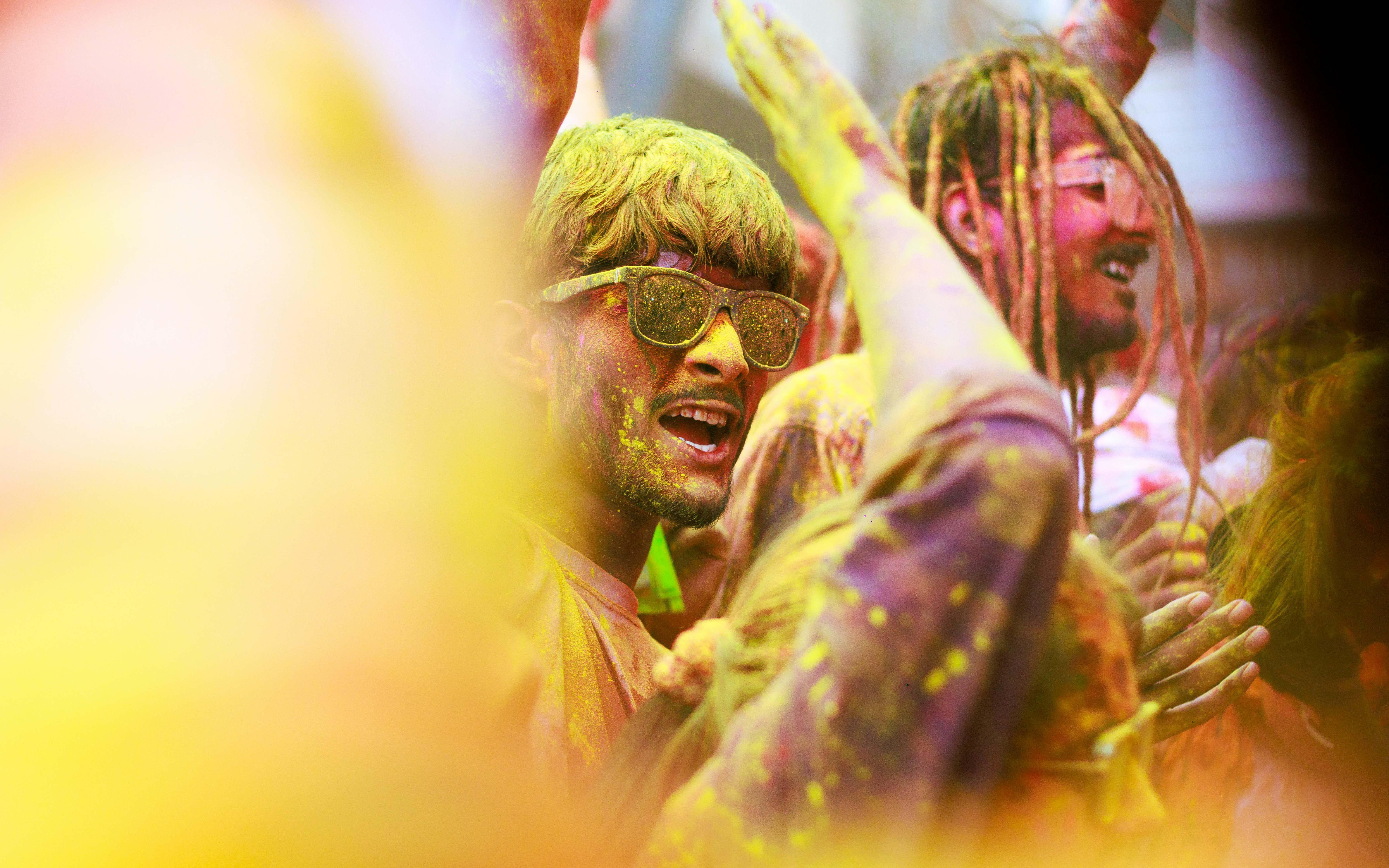 A group of people covered in colored powder photo – Free Person Image ...