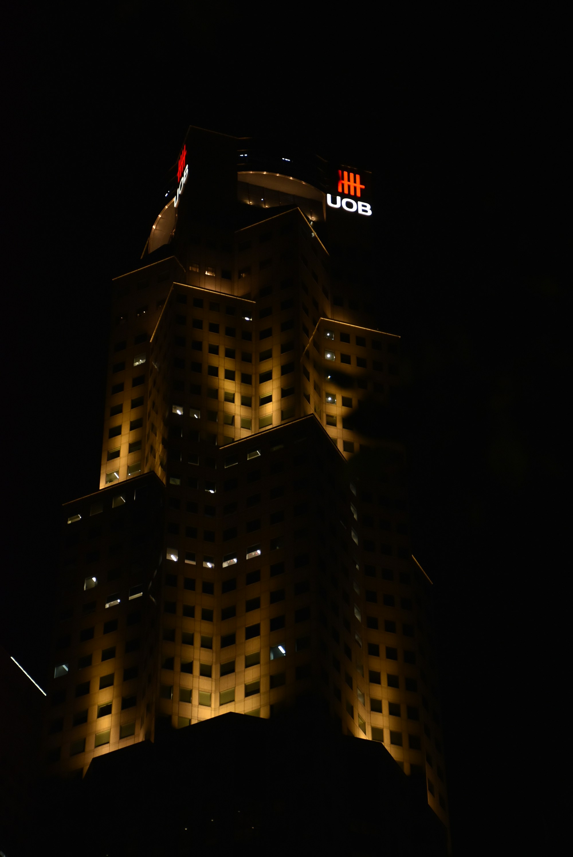 Crowning Glow: UOB Tower Illuminated Against the Night