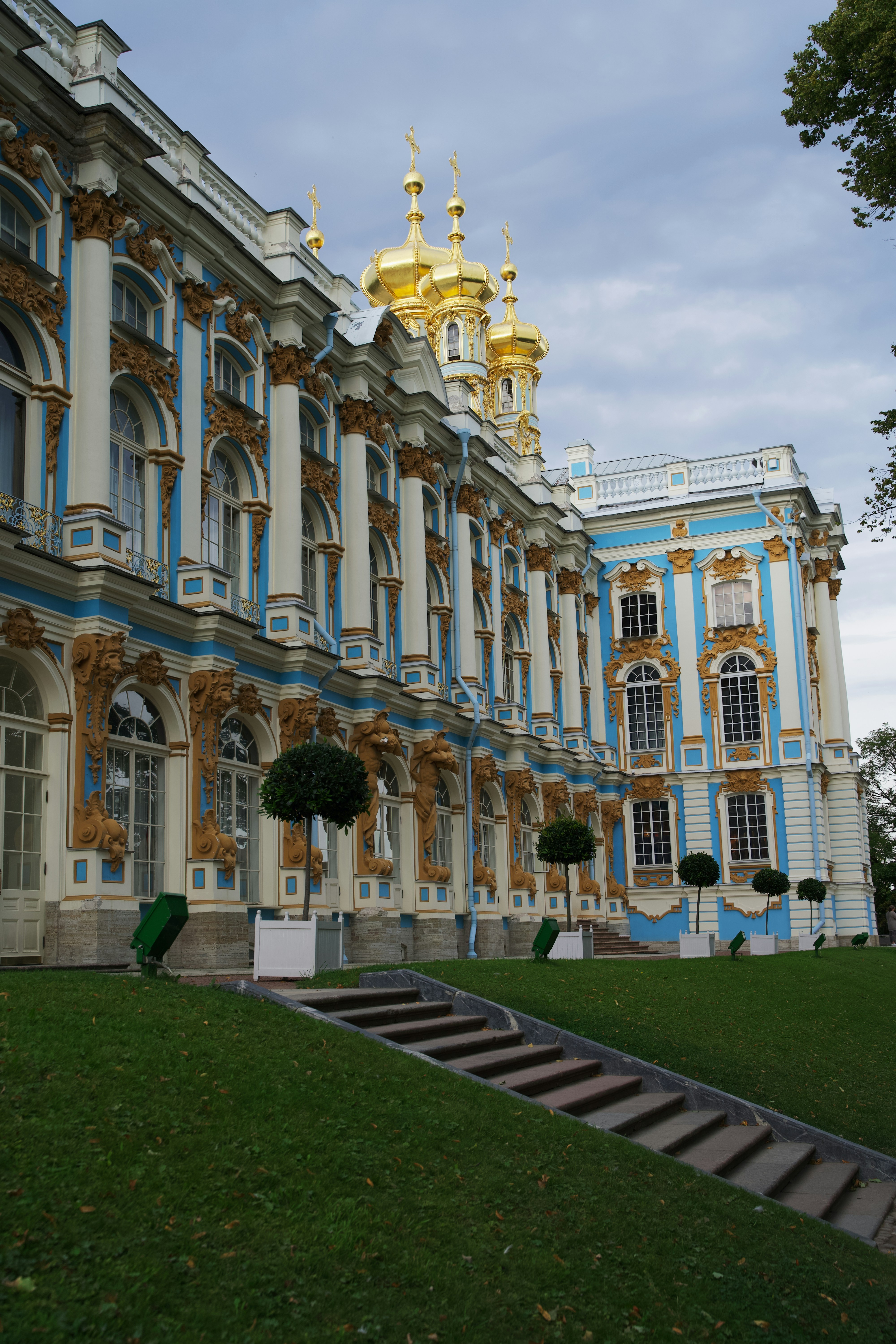 A large blue and white building with gold trim photo – Free Archicture ...