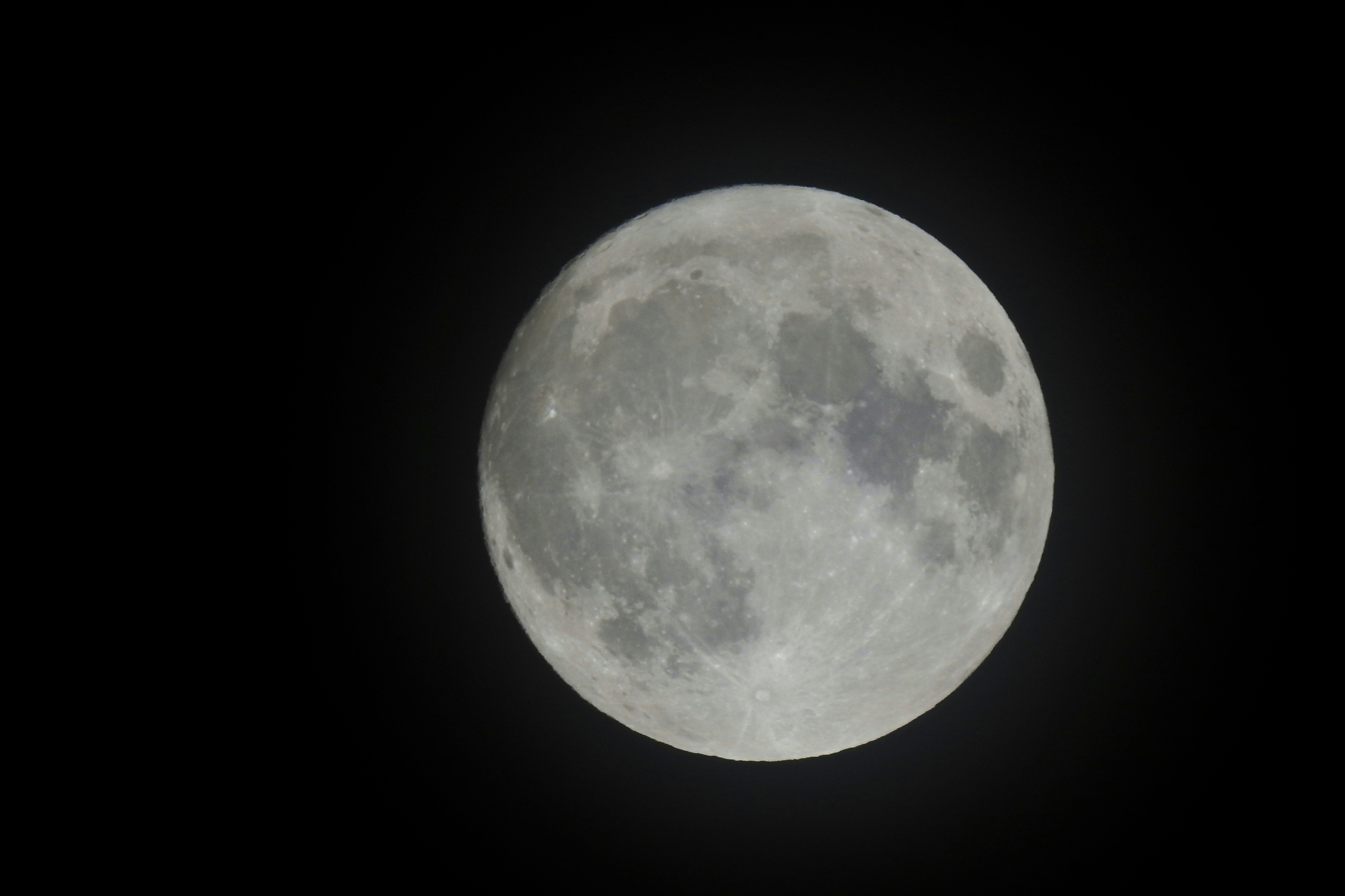 A full moon is seen in the dark sky photo – Free Super blue moon Image ...