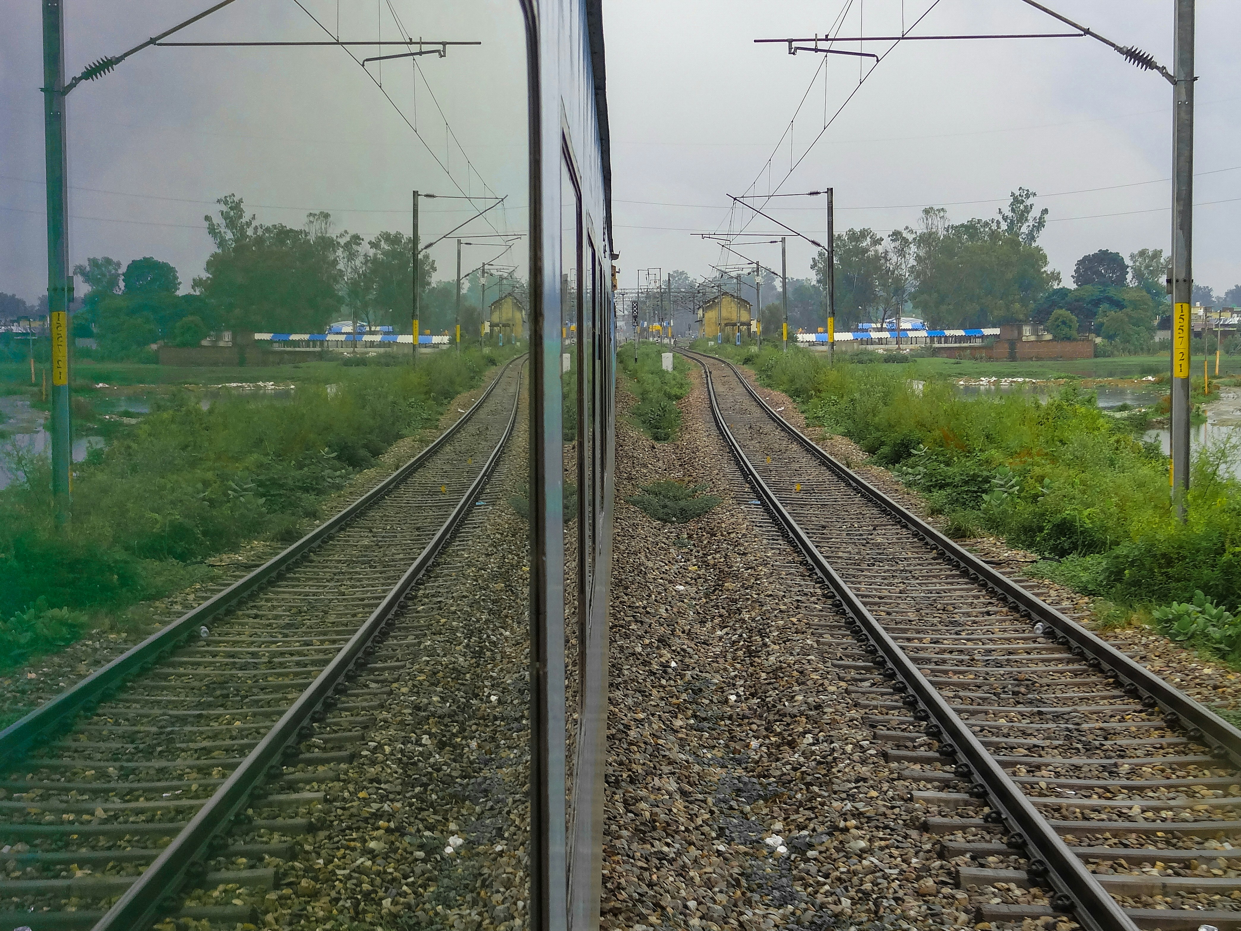 A view of a train track through a mirror photo – Free Roorkee Image on ...