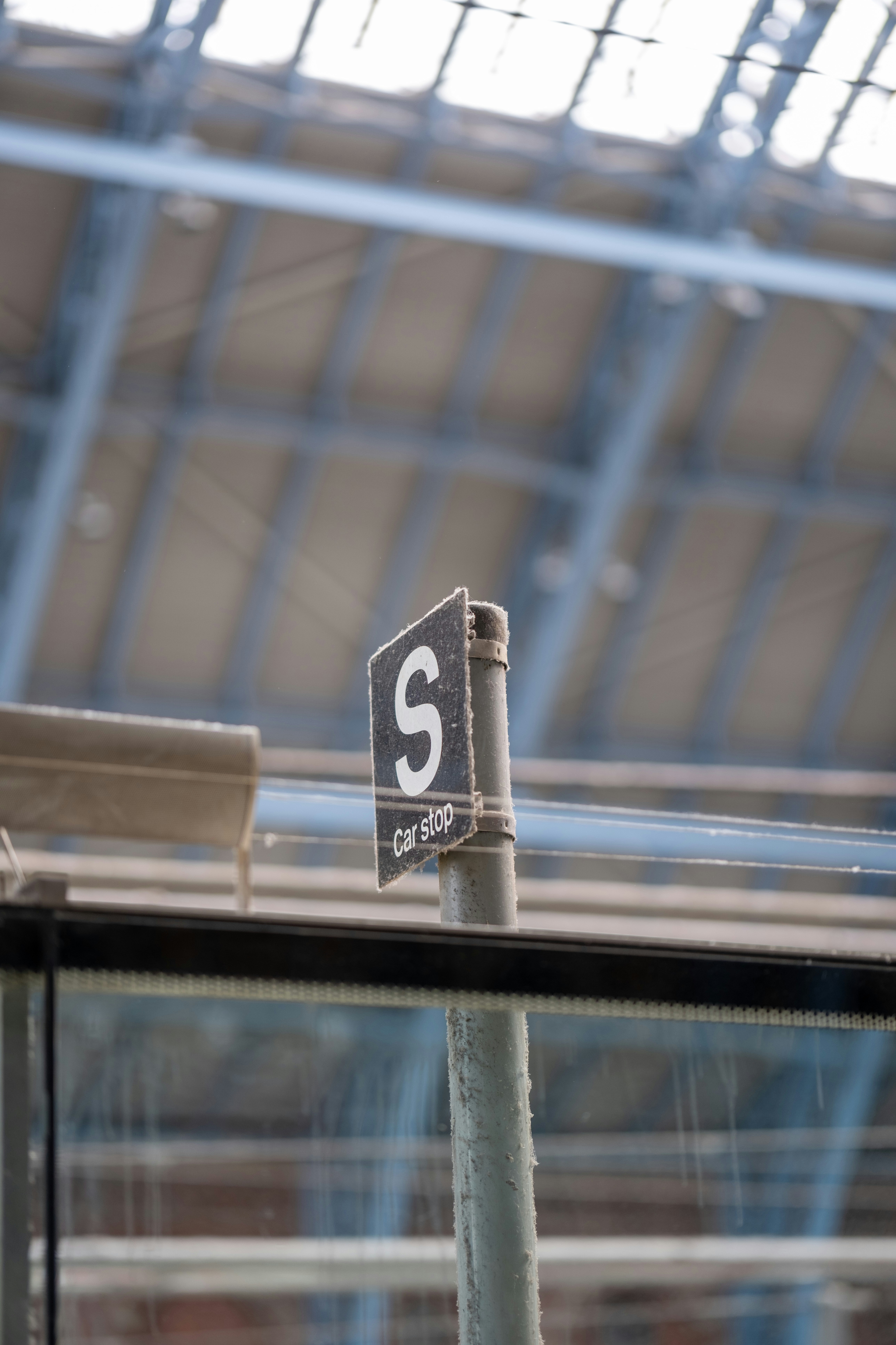 A street sign in front of a train station photo – Free Uk Image on Unsplash